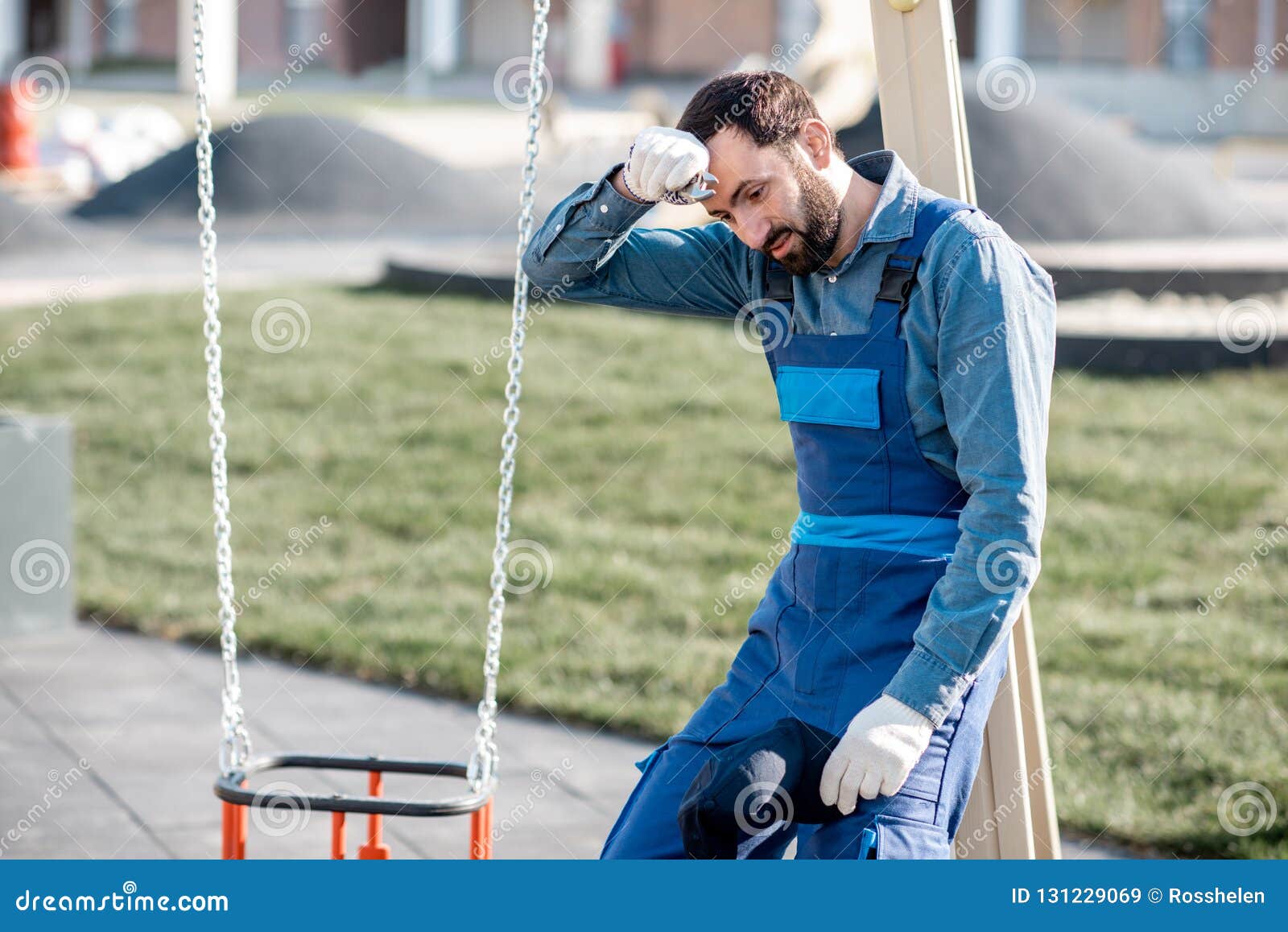 Tired Workman in the Payground Stock Image - Image of industrial ...