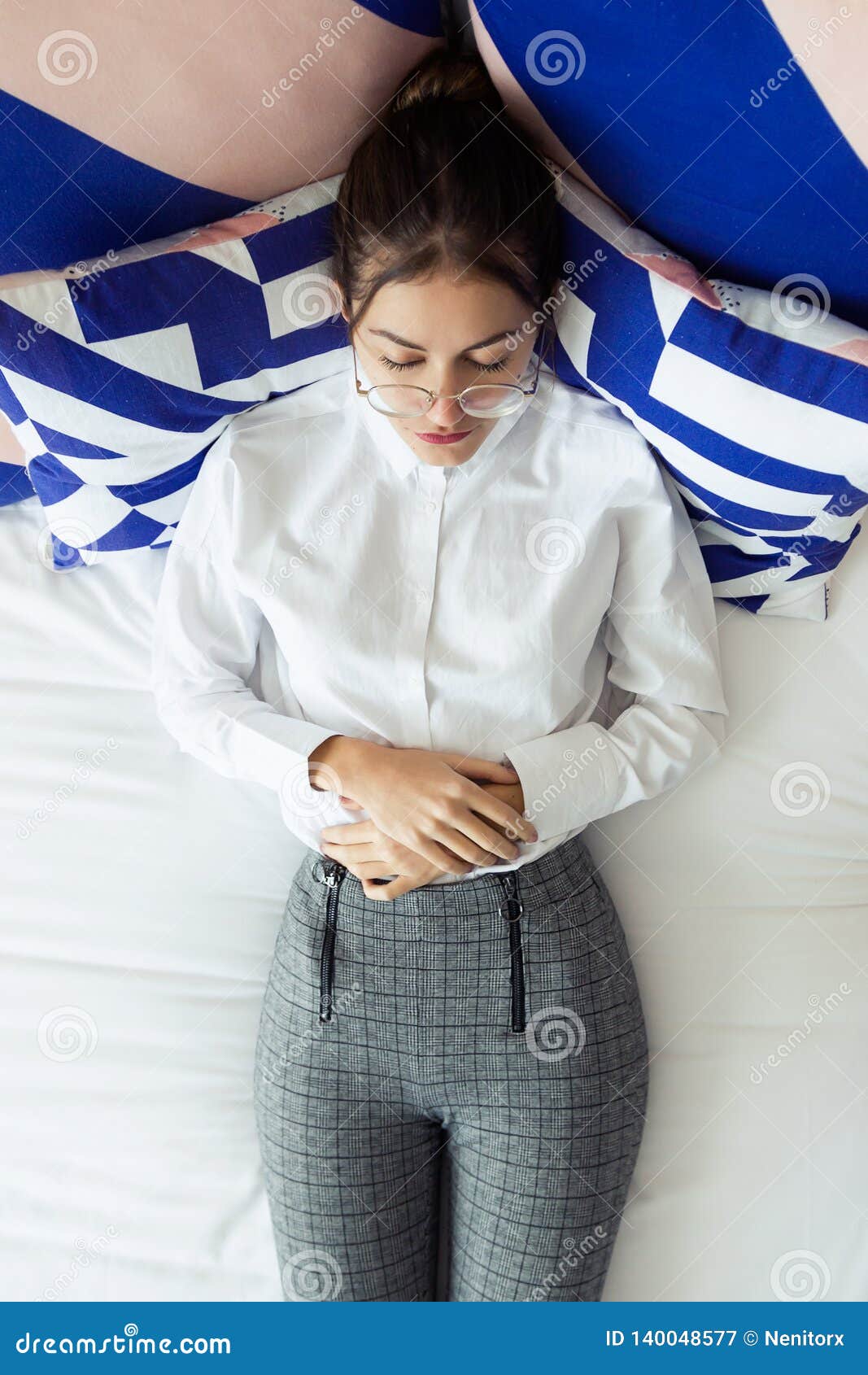 Tired Young Businesswoman Lying and Relaxing in Bed at Hotel Room Stock ... Tired Young Businesswoman Lying and Relaxing in Bed at Hotel Room Stock ...