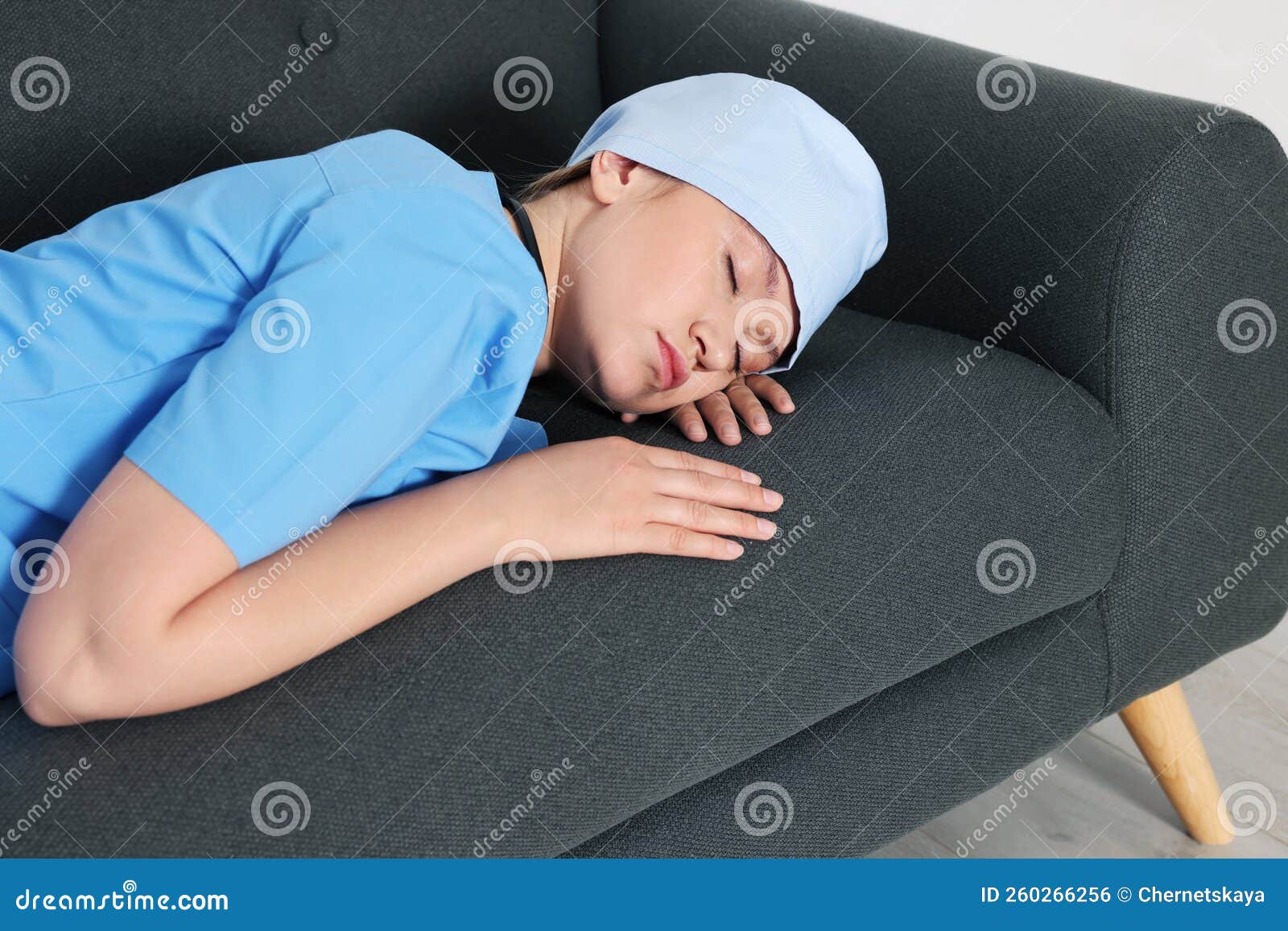 Tired Young Doctor Sleeping on Sofa Indoors Stock Photo - Image of ...