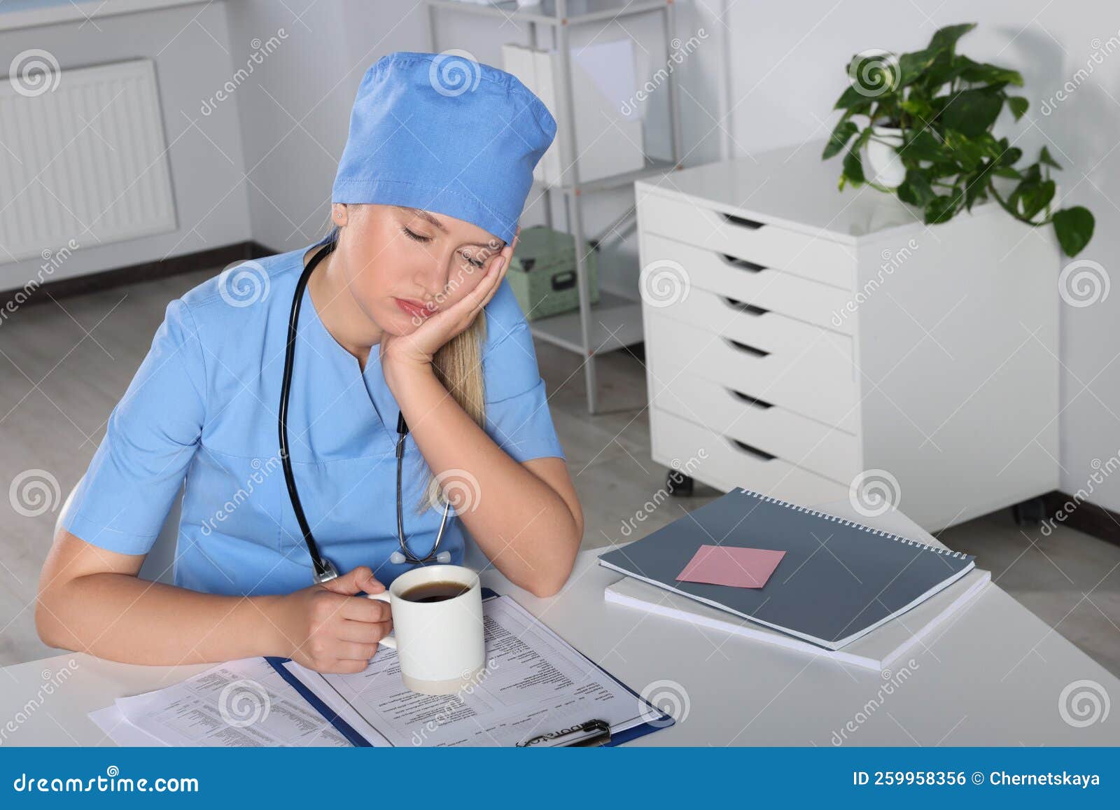 Tired Young Doctor Sleeping at Workplace in Office Stock Photo - Image ...