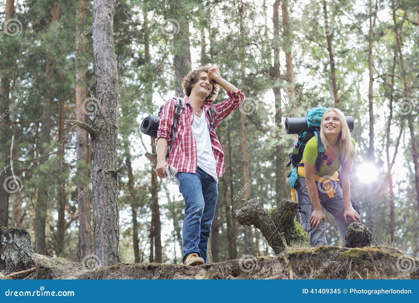 Tired Young Hiking Couple Taking a Break in Forest Stock Image - Image ...