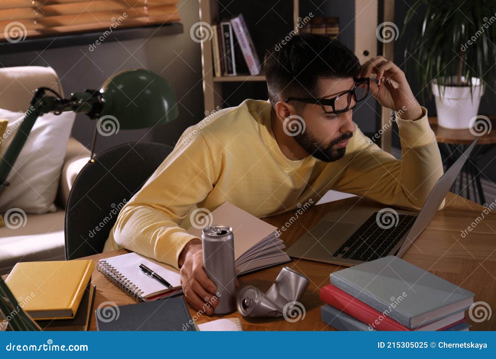 Tired Young Man with Energy Drink Studying at Home Stock Image - Image ...