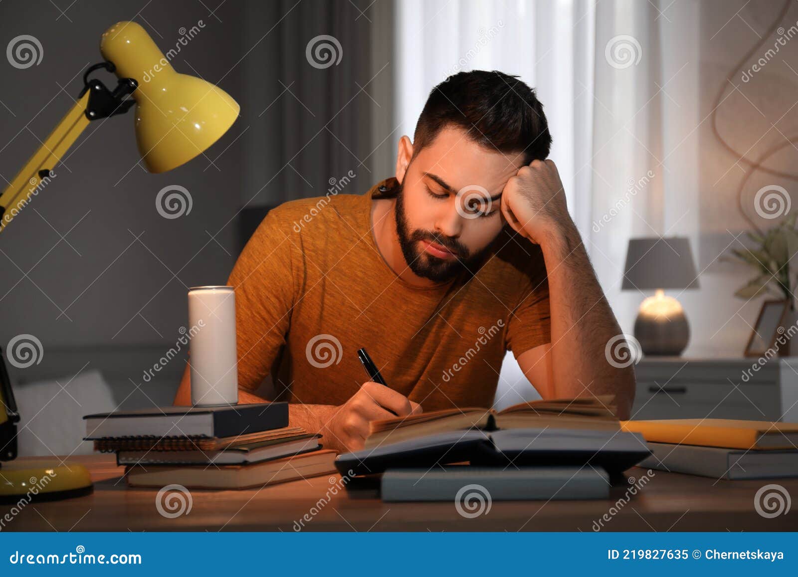 Tired Young Man with Energy Drink Studying at Home Stock Image - Image ...