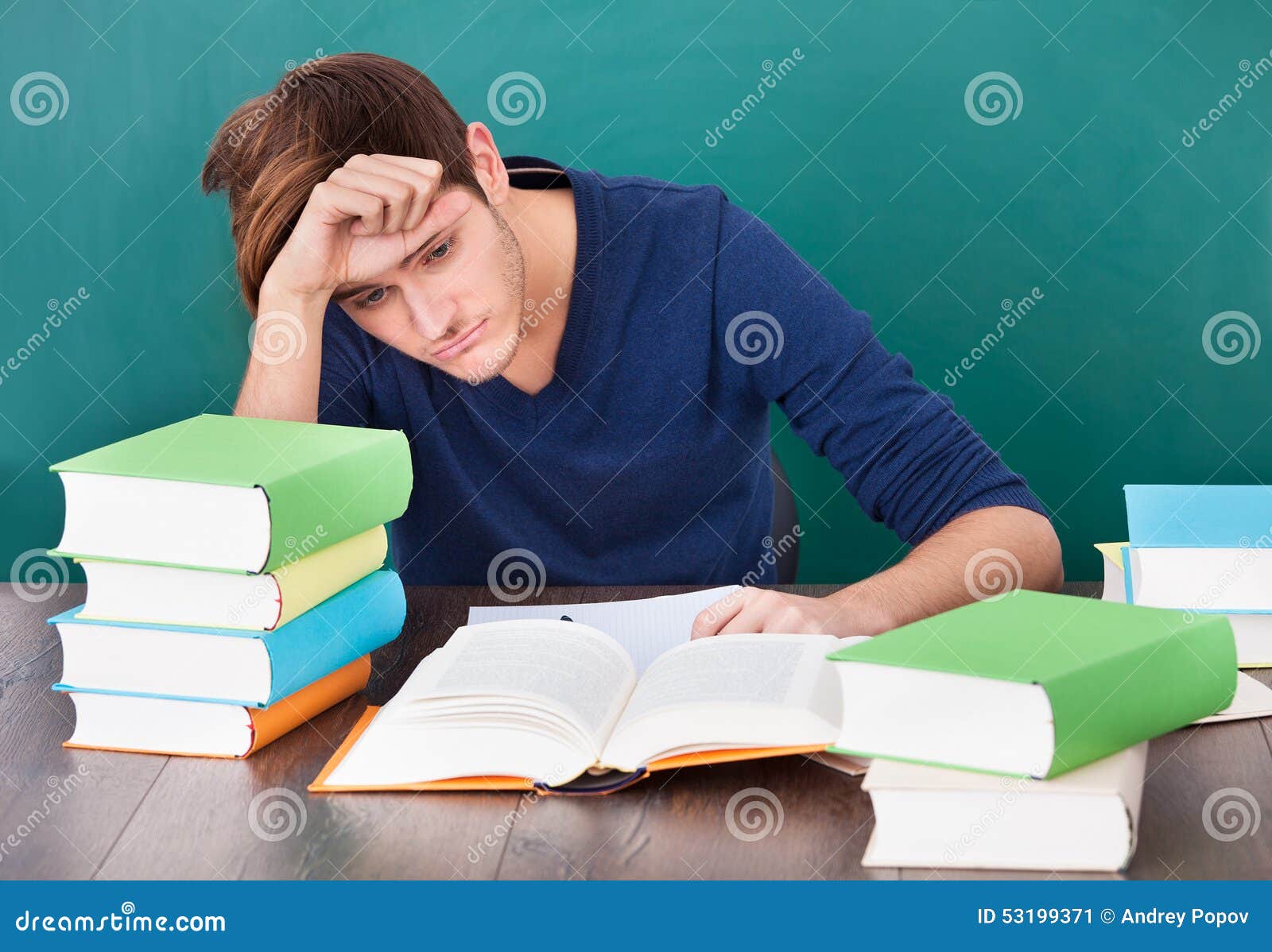 Tired young man studying stock image. Image of knowledge - 53199371