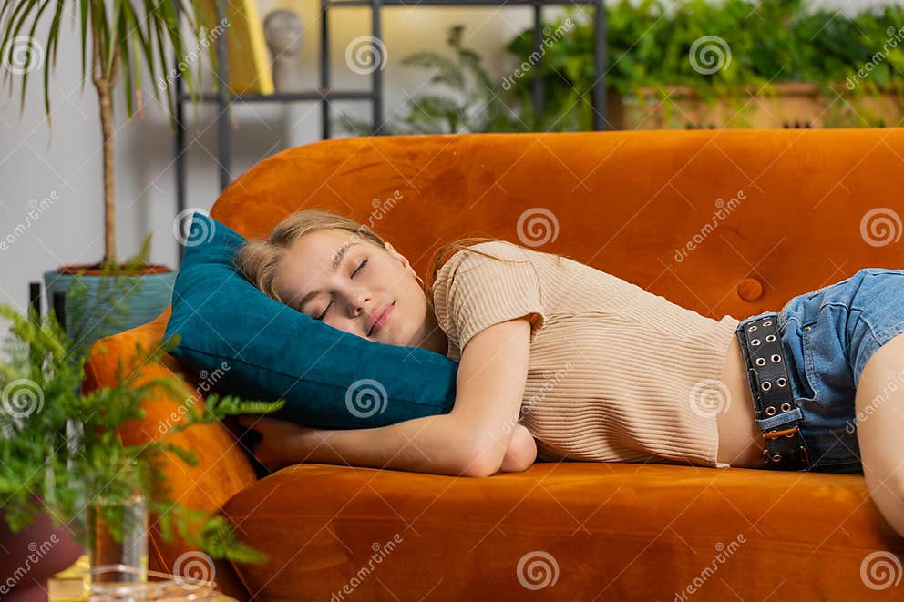 Tired Young Woman Girl Lying Down In Bed Taking A Rest At Home Napping Falling Asleep On Couch