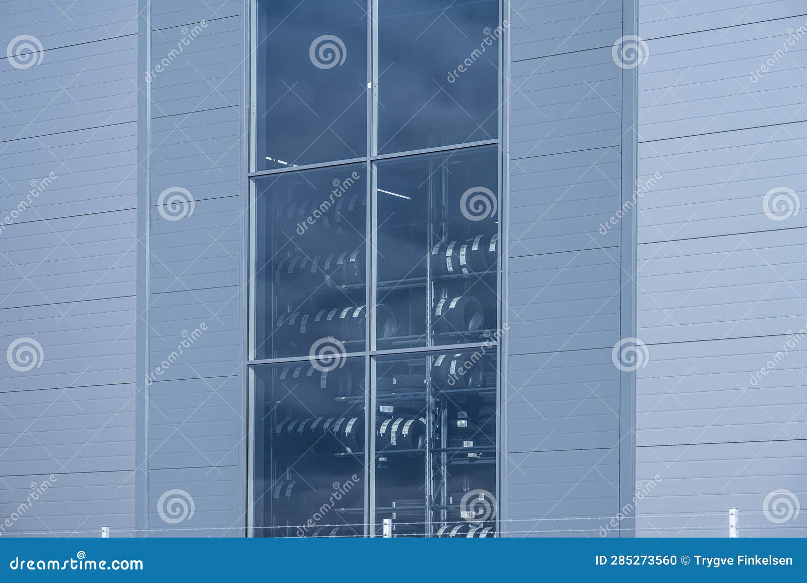 Tires Visible through a Window at a Large Warehouse.. Stock Photo ...