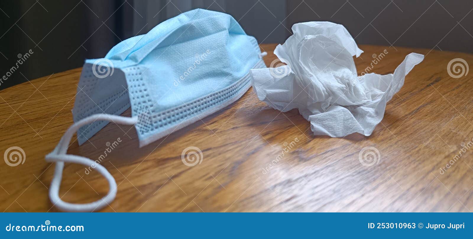 A Tissue and a Mask are on the Table Brown Stock Image - Image of table ...
