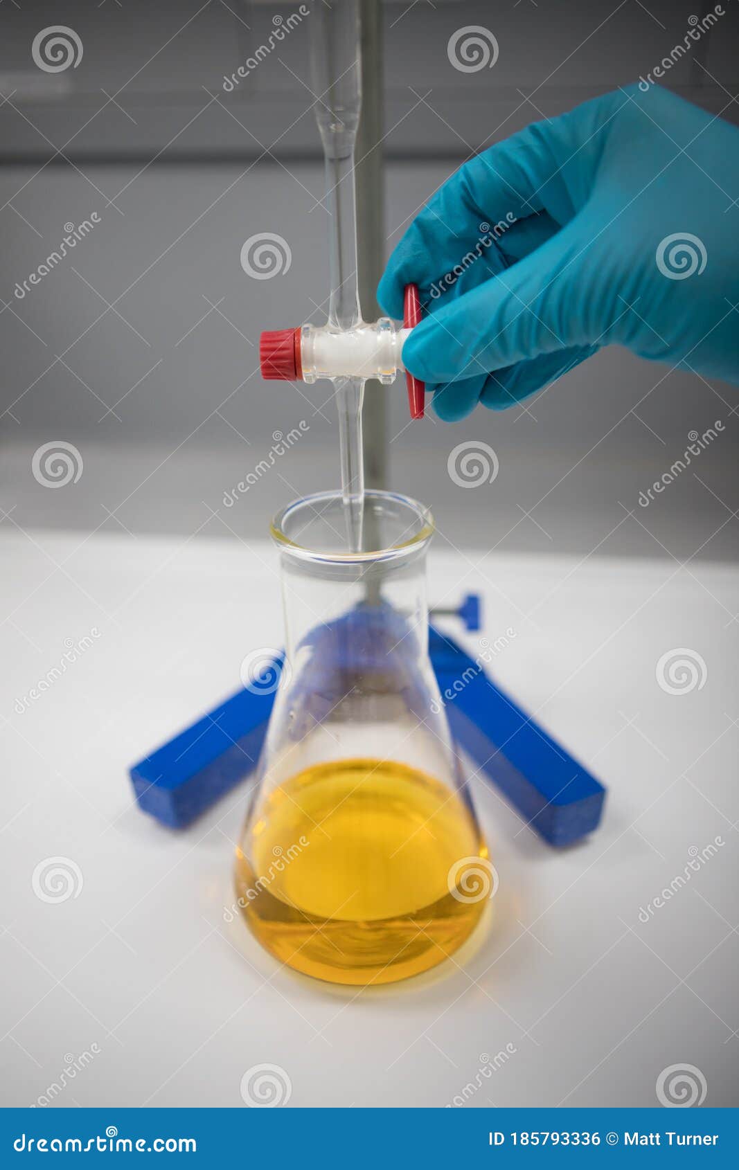 Titration of a Solution Using an Orange Indicator. Chemist in a ...