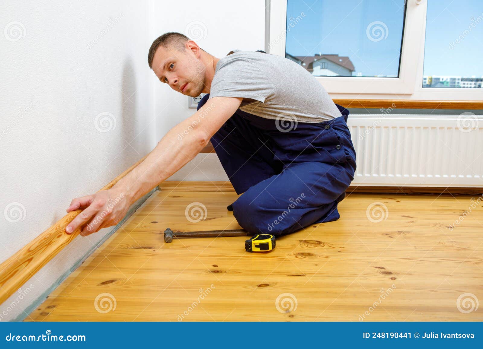 To Make Repairs. Installing a New Skirting Board Stock Image - Image of ...