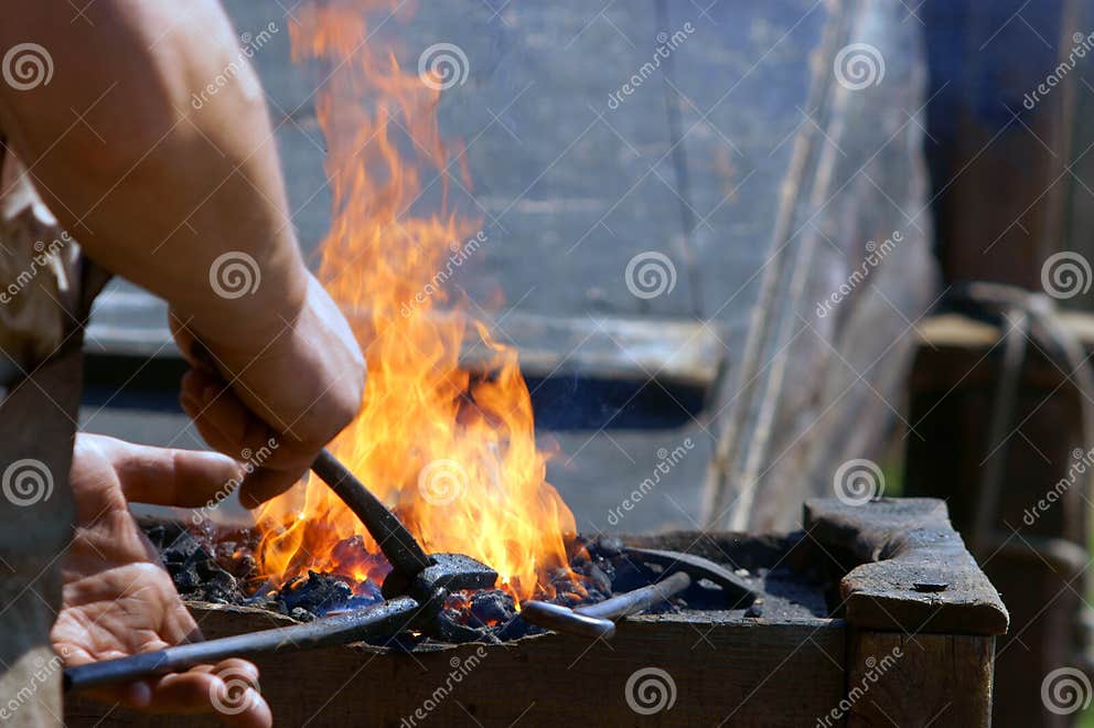 To Strike while the Iron is Hot Stock Photo - Image of strength, anvil ...