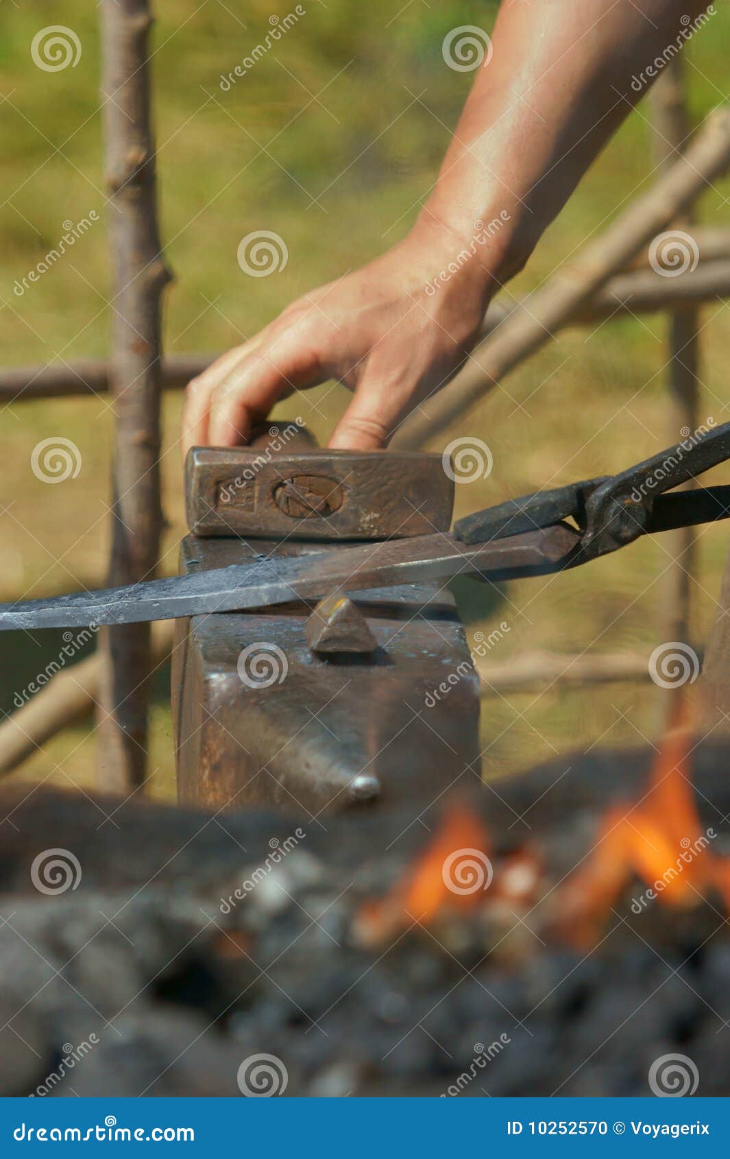 To Strike while the Iron is Hot Stock Photo - Image of hand, strong ...