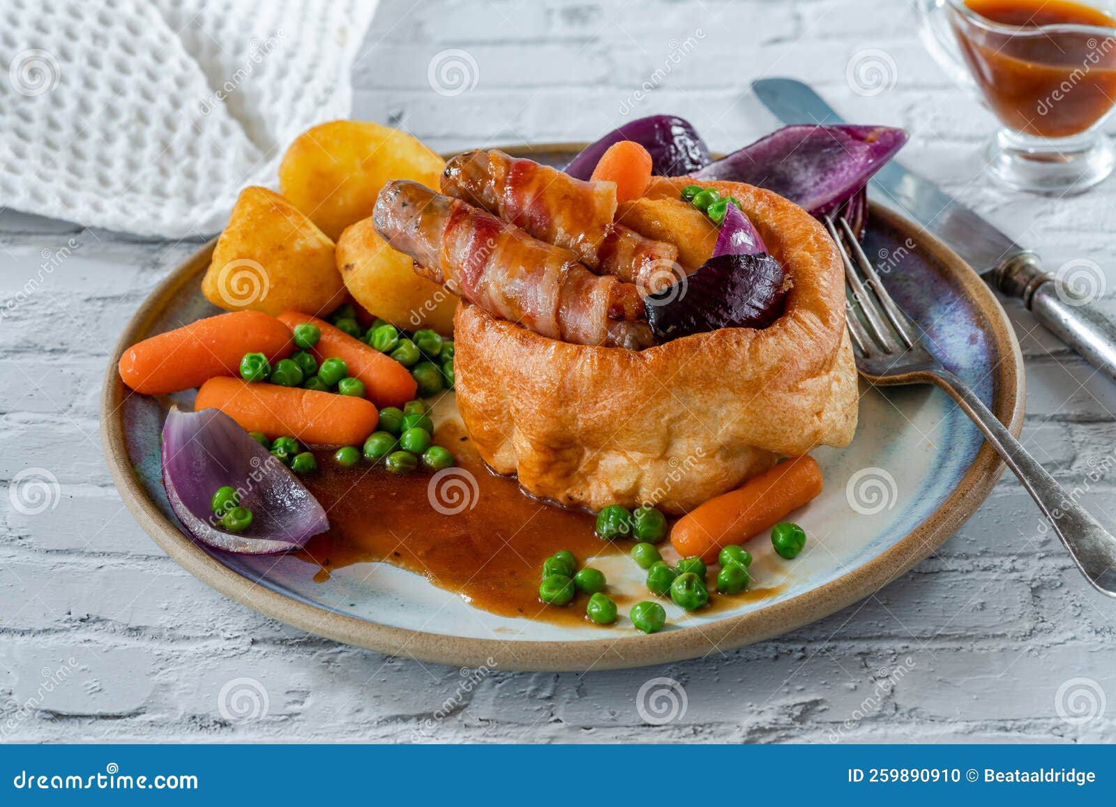 Toad-in-the-hole stock photo. Image of lunch, menu, onion - 259890910