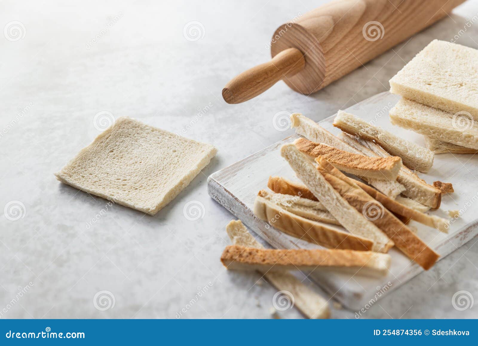 Bread Slice Thinned with Roller Pin and Bread Crusts on Table Stock ...
