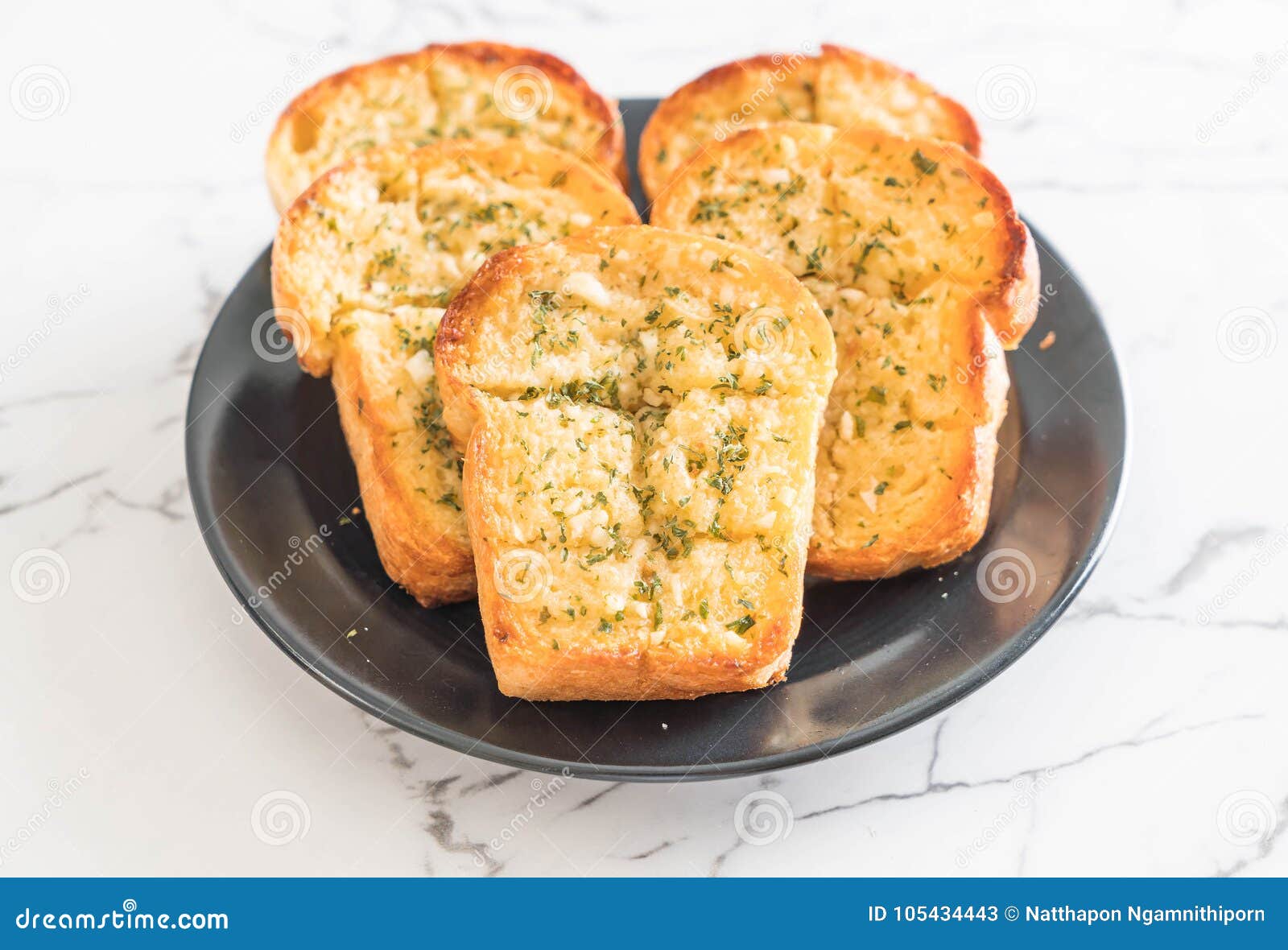 Garlic bread on plate stock image. Image of buttered - 105434443