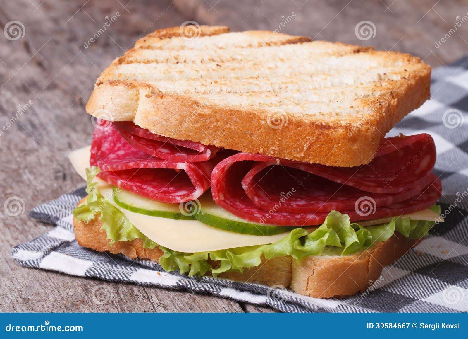 Toast with Salami, Cheese and Vegetables on an Old Table Stock Image ...