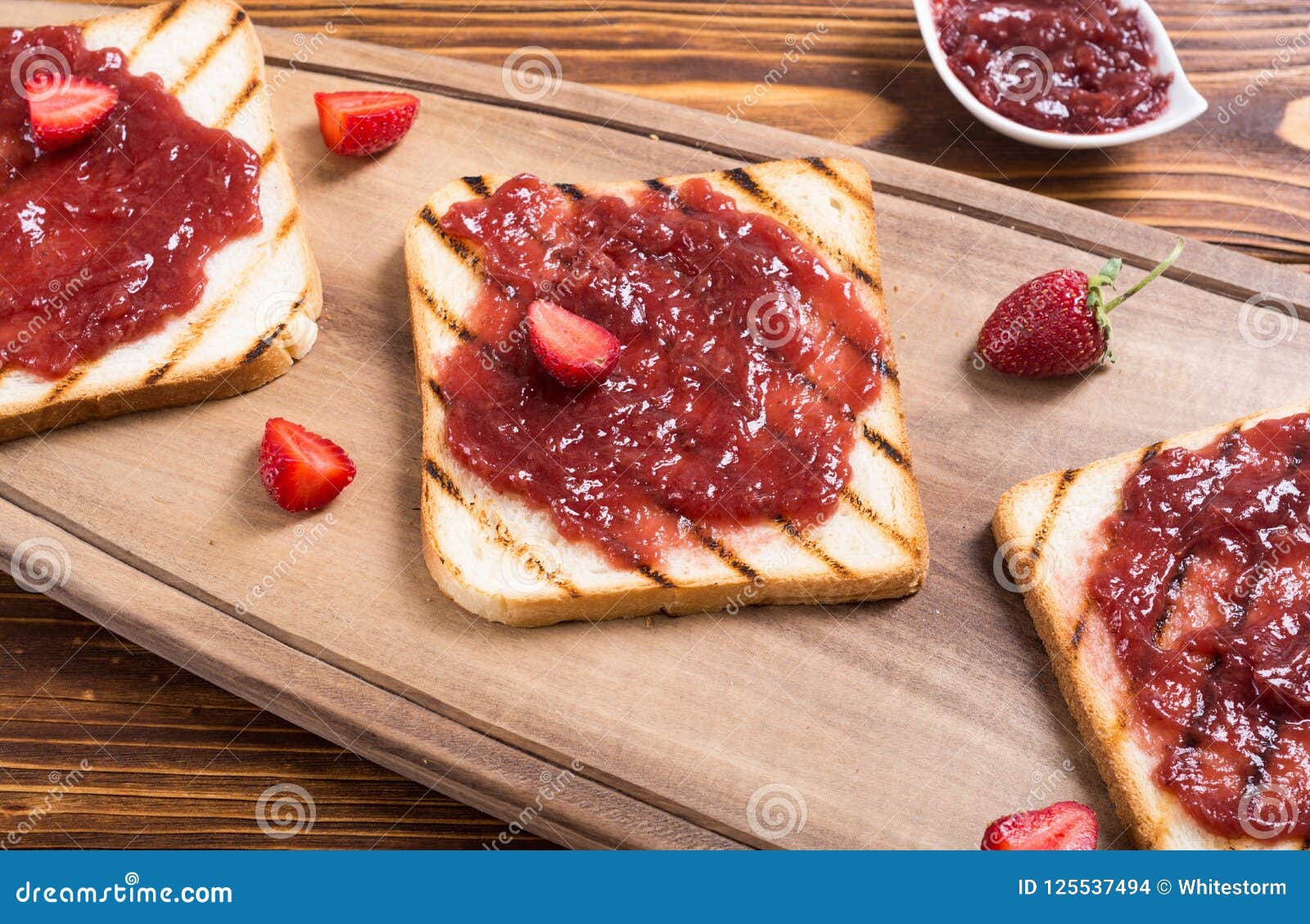 Toast with strawberry jam stock photo. Image of ingredient - 125537494