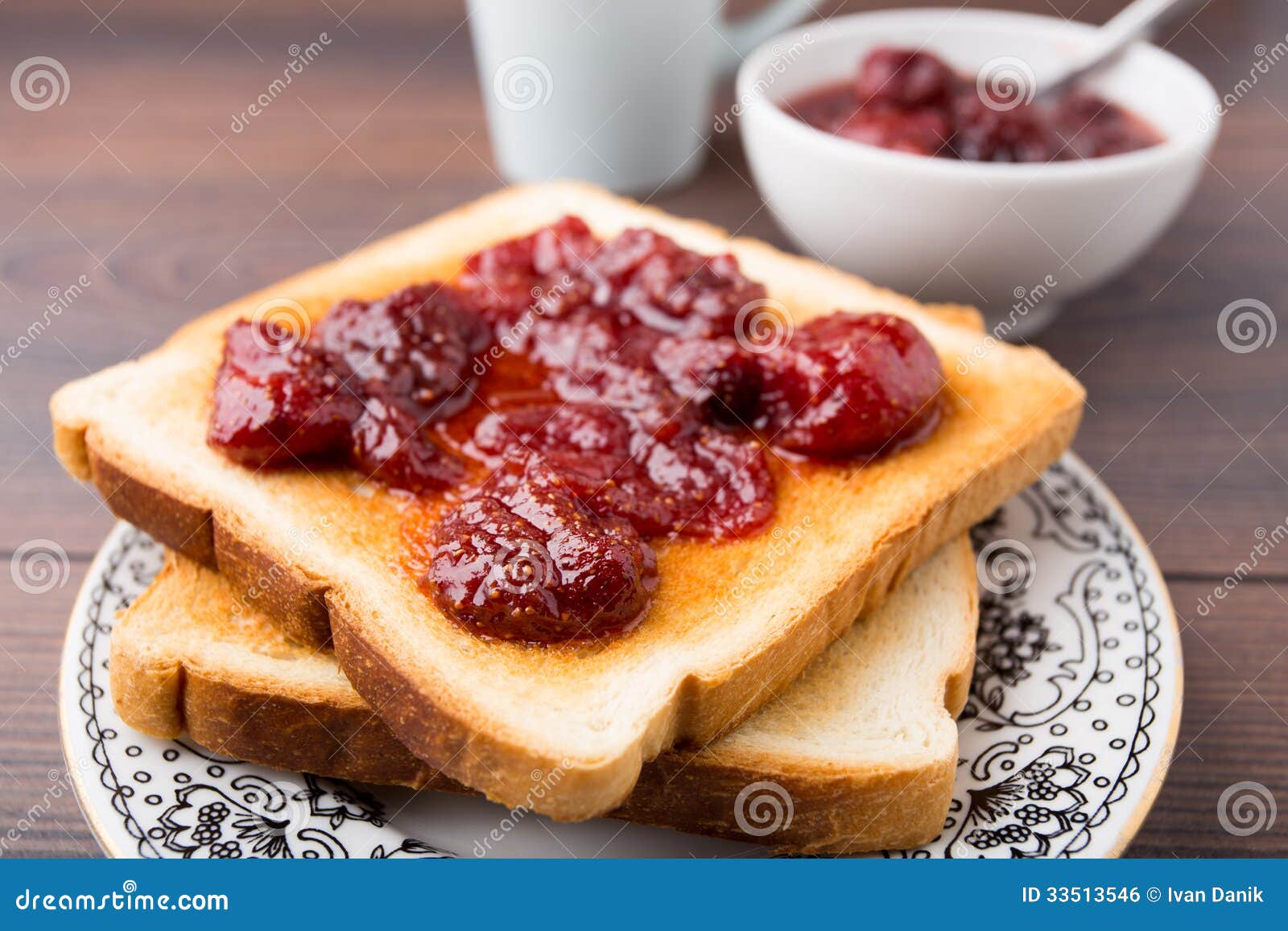 Toast with strawberry jam stock photo. Image of table - 33513546
