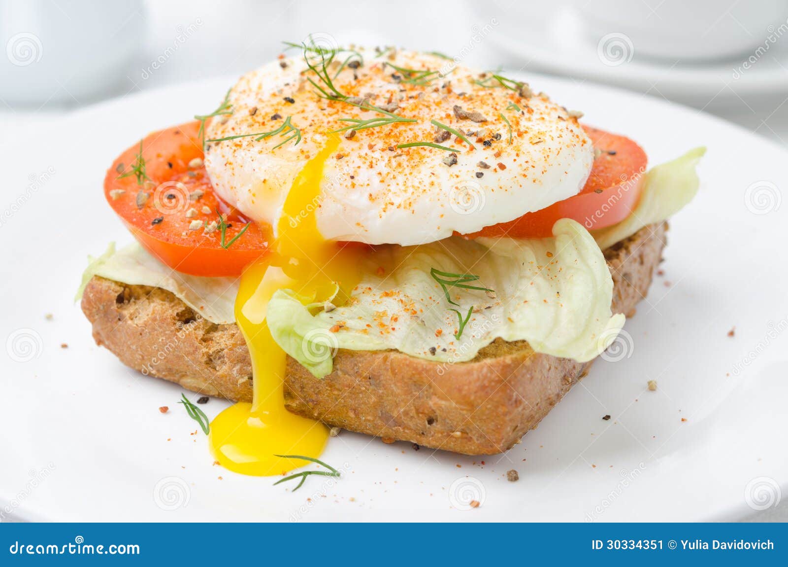 Toast with Tomato, Lettuce and Poached Egg for Breakfast Closeup Stock ...