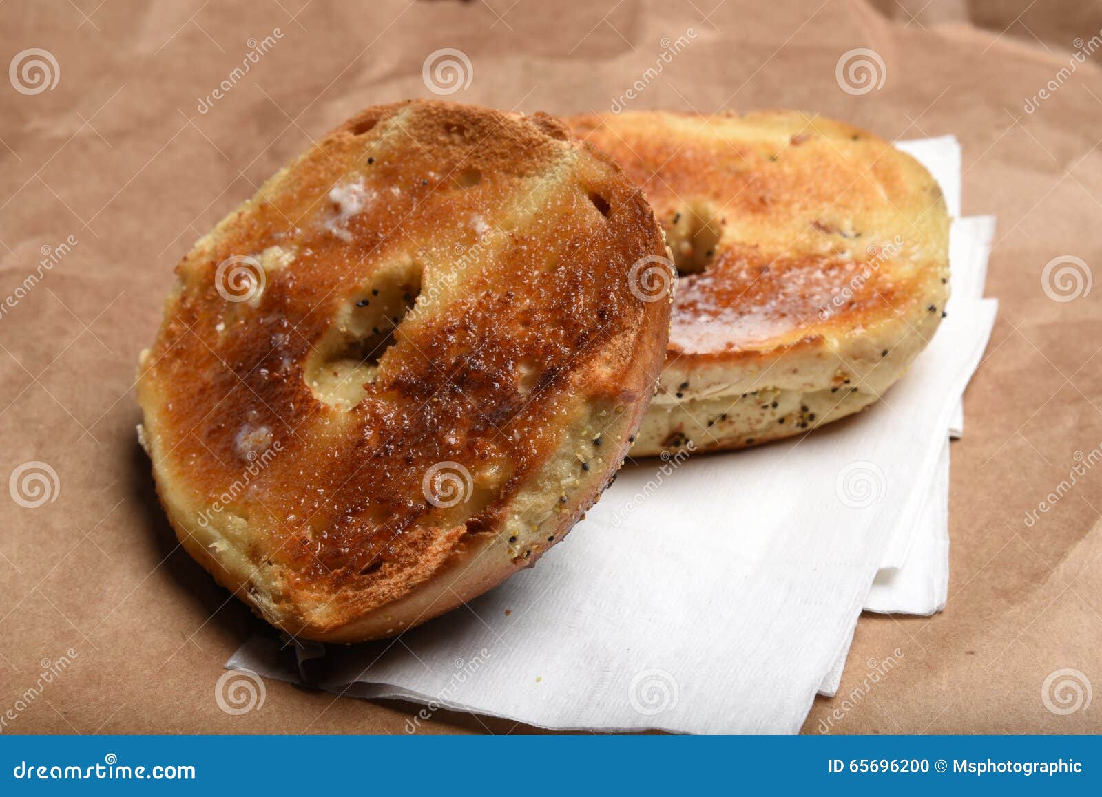 Toasted bagel stock photo. Image of fast, paper, buttered - 65696200