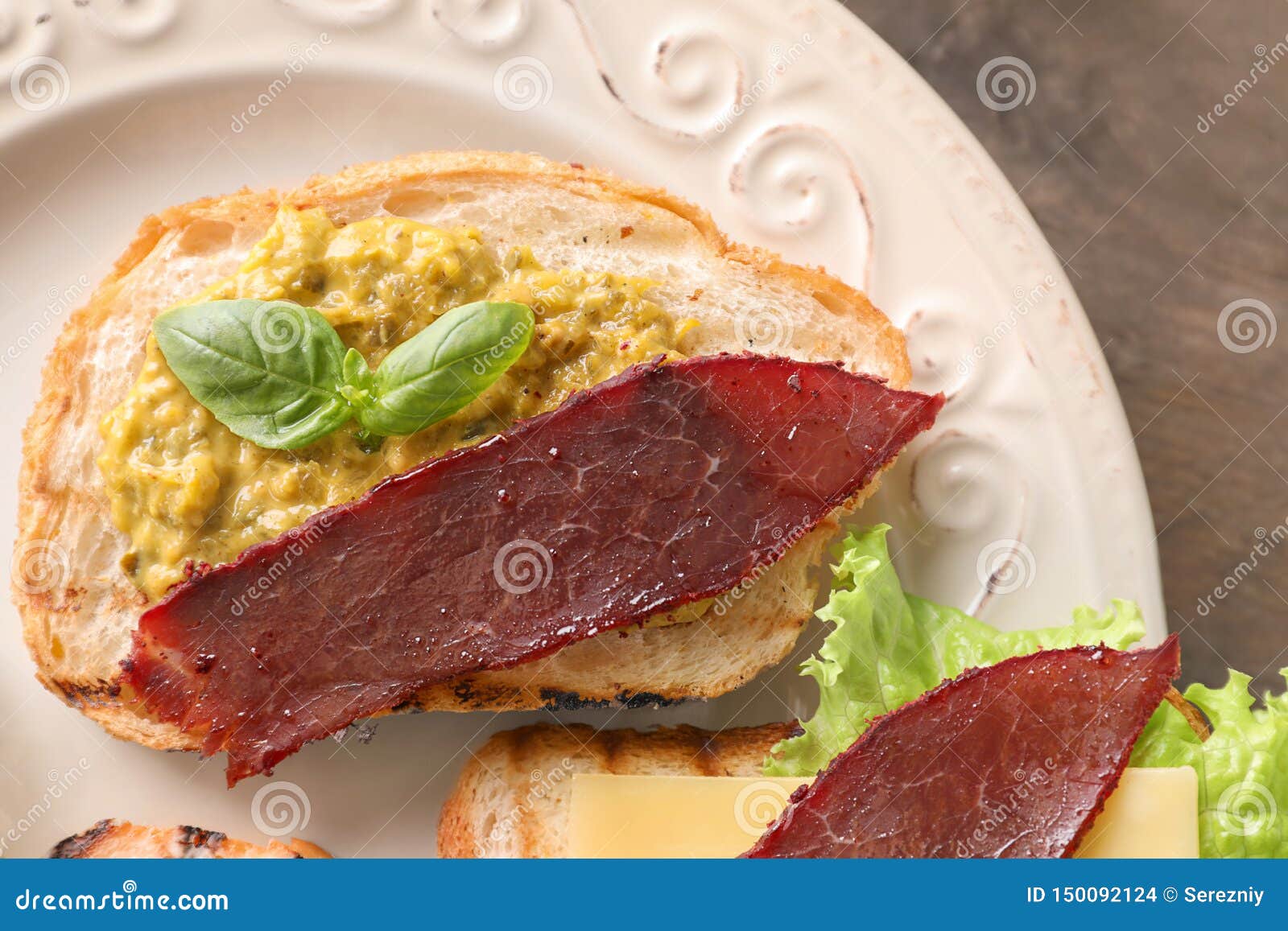 Toasted Bread with Meat on Plate, Closeup Stock Photo - Image of ...