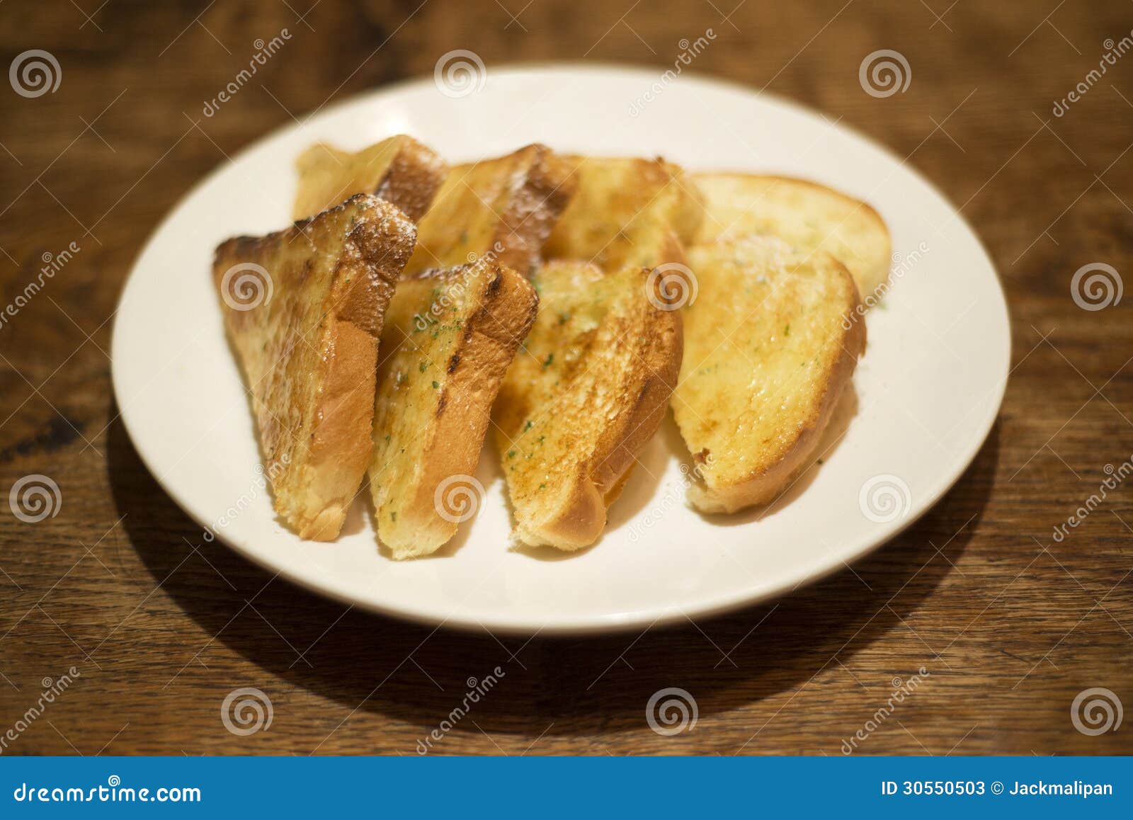 Toasted bread on plate stock image. Image of side, snack - 30550503
