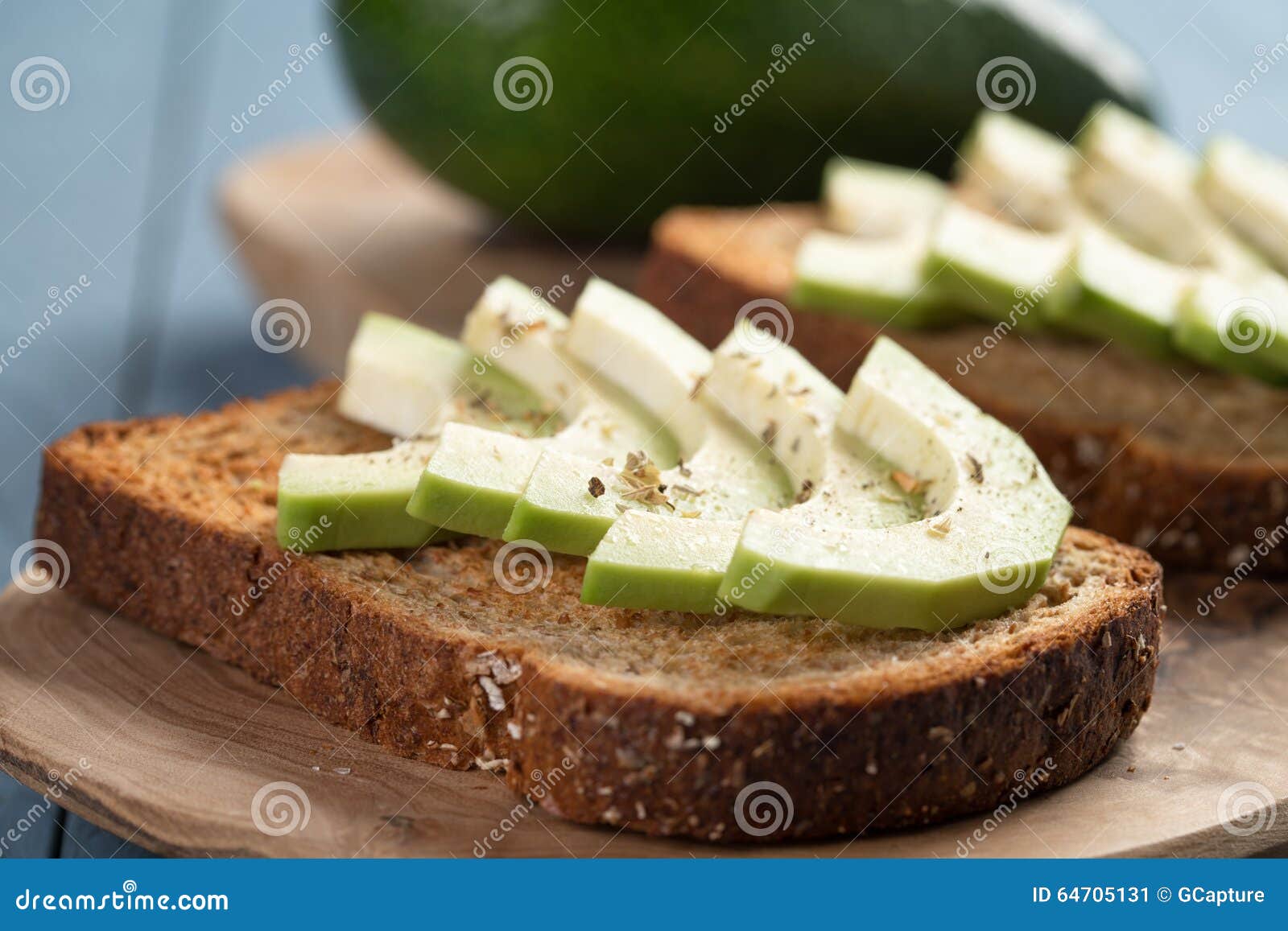 Toasted Rye Bread with Sliced Avocado and Herbs Stock Image - Image of ...