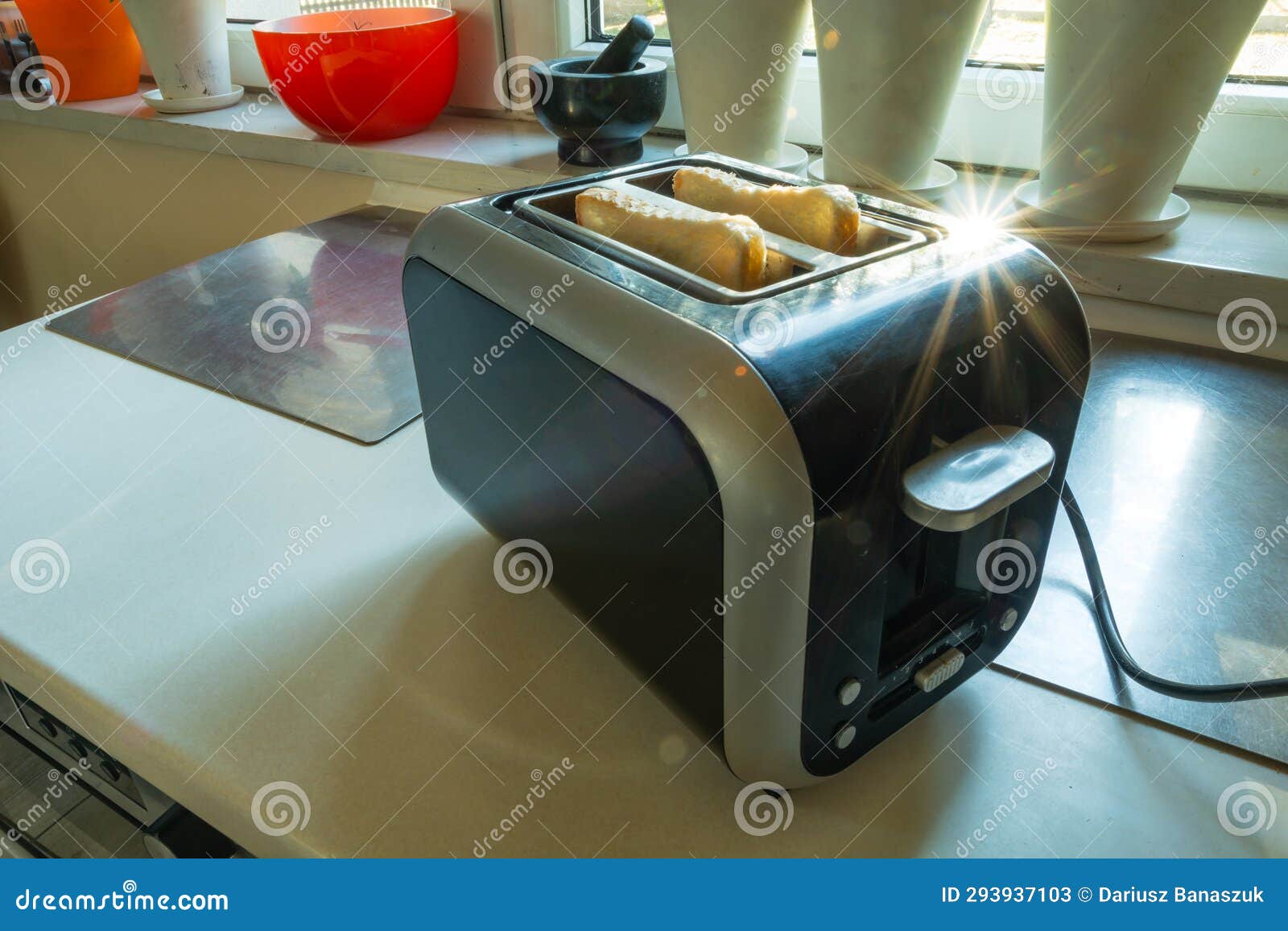 A Toaster with Slices of Toast Standing on the Kitchen Counter Stock ...