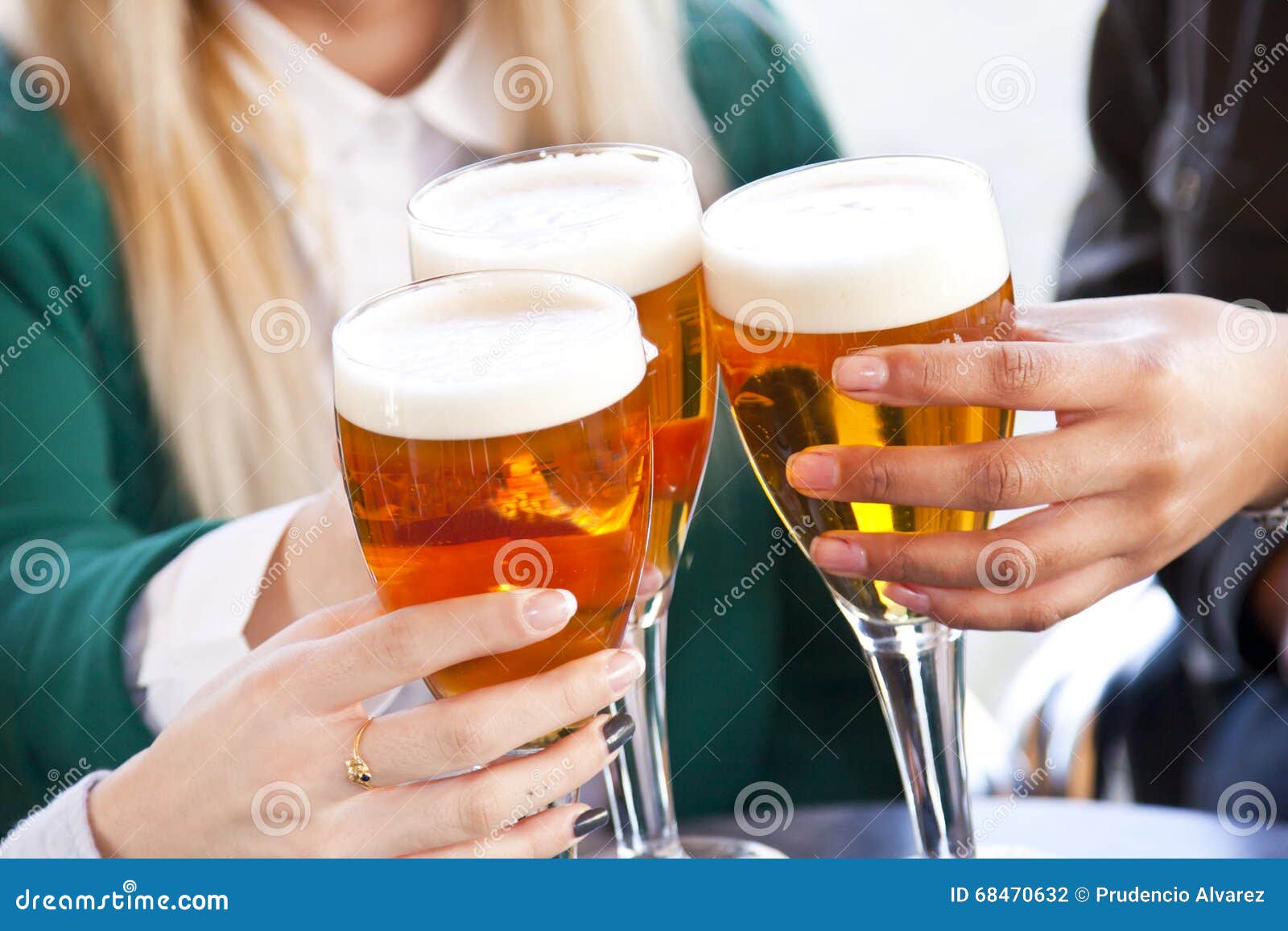 Toasting with beer stock photo. Image of glasses, happy - 68470632