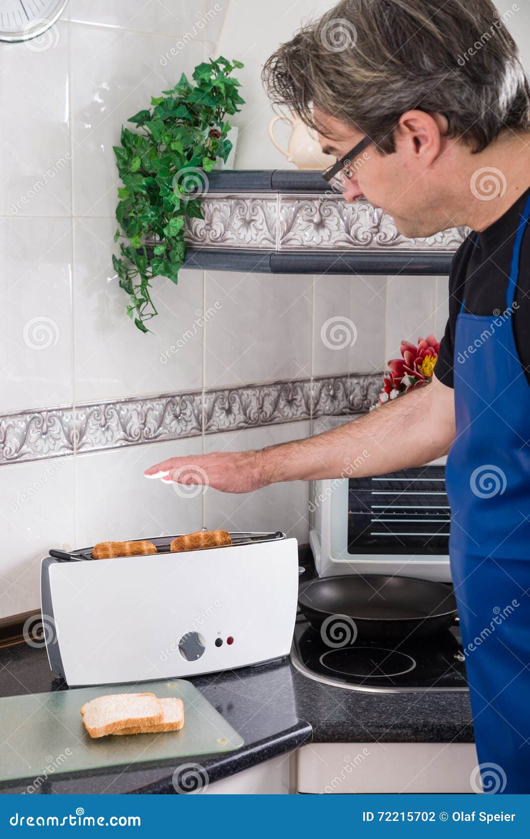 Toasting bread stock photo. Image of kitchen, bread, househusban - 72215702