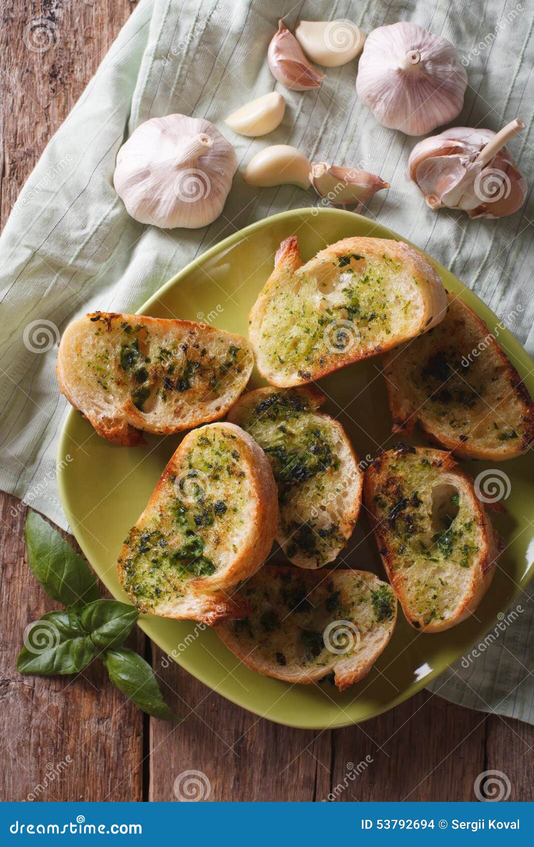 Toasts with Basil and Garlic Close-up, Top View Vertical Stock Photo ...