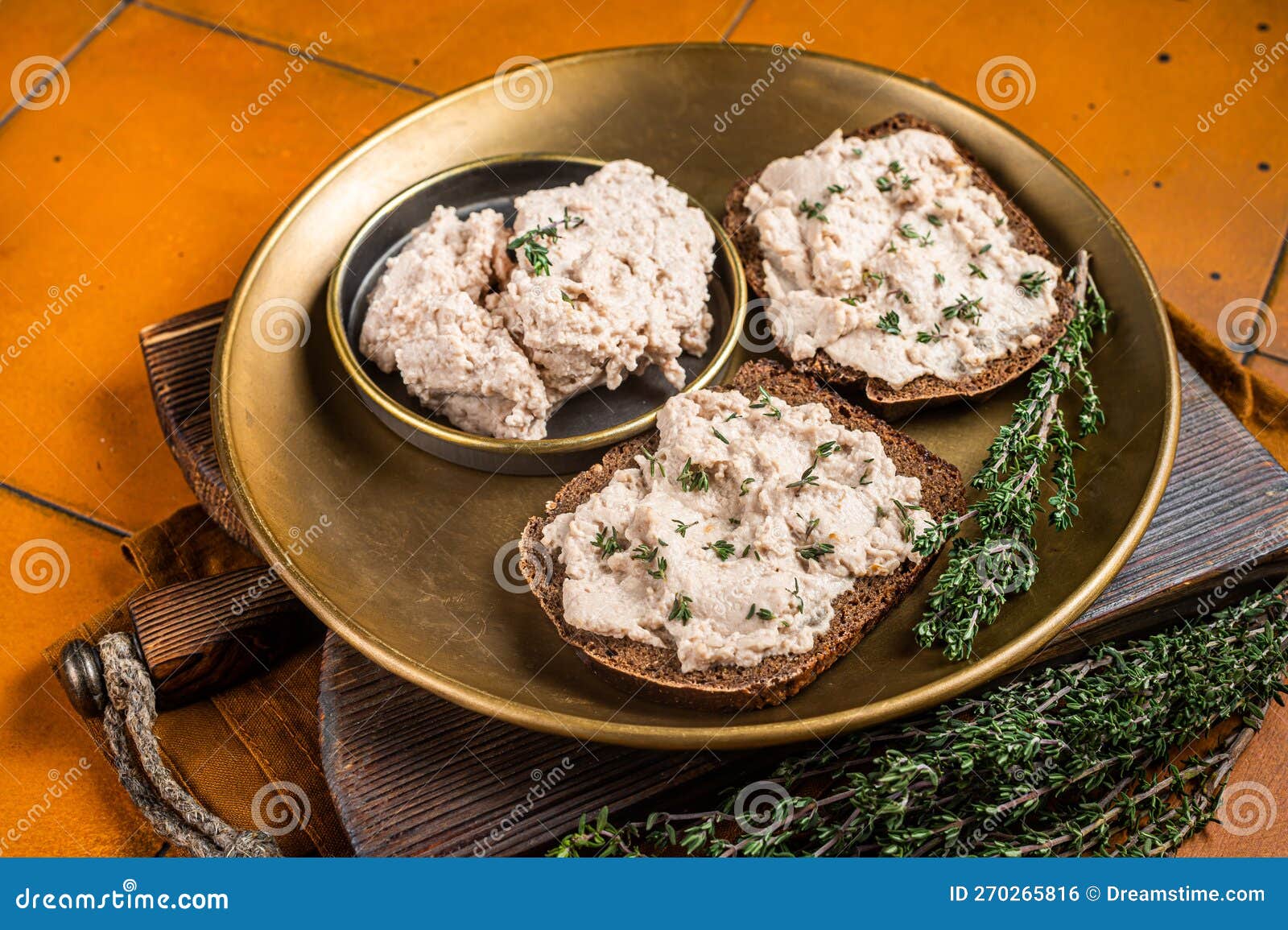Toasts with Cod Liver Spread Pate on a Plate. Orange Background Stock ...