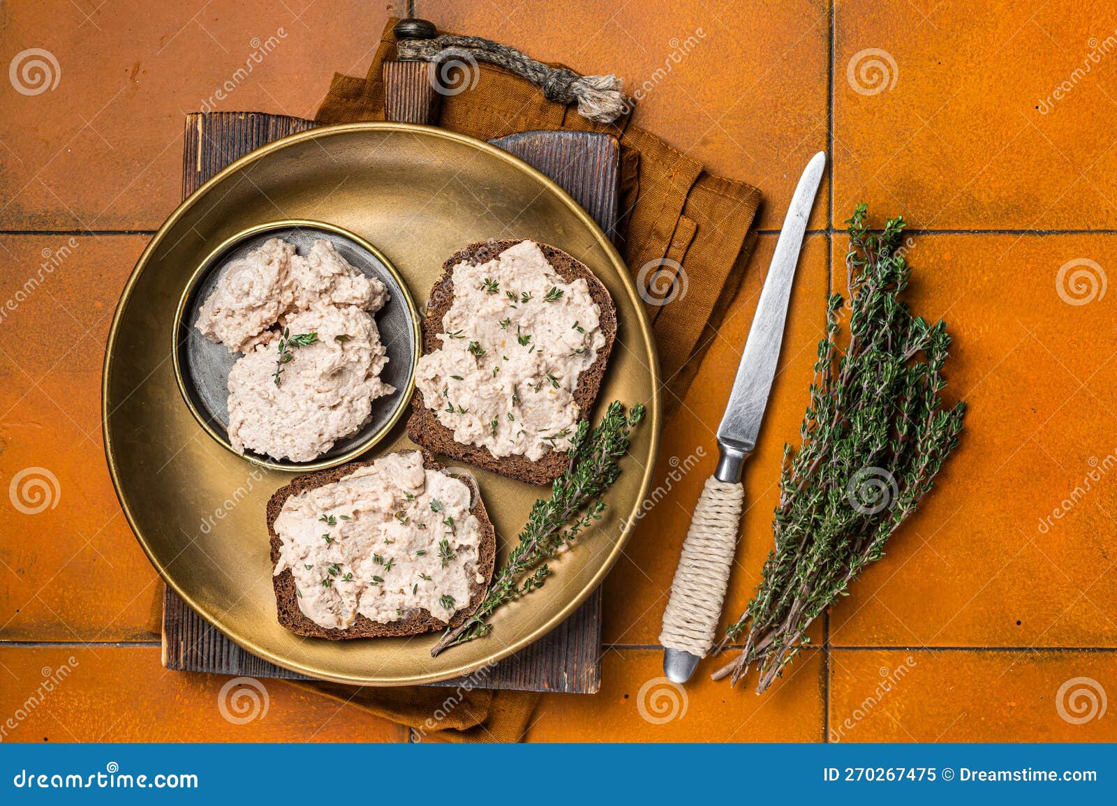 Toasts with Cod Liver Spread Pate on a Plate. Orange Background Stock ...