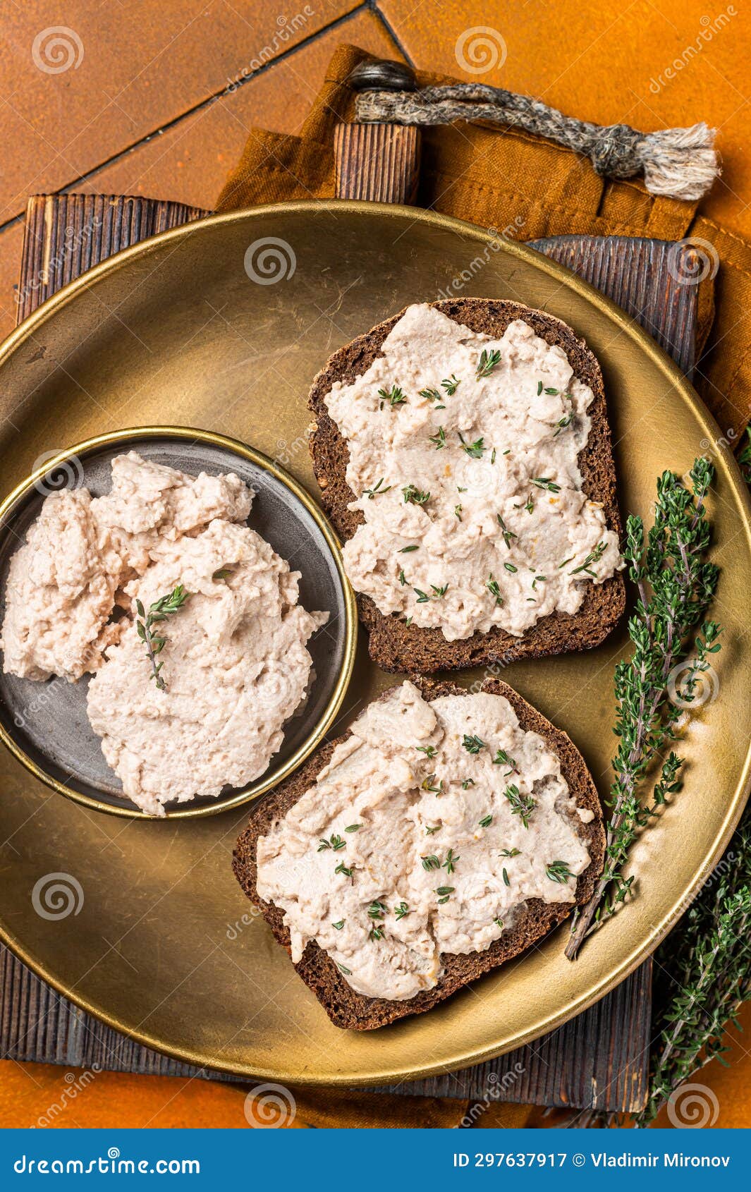 Toasts with Cod Liver Spread Pate on a Plate. Orange Background Stock ...