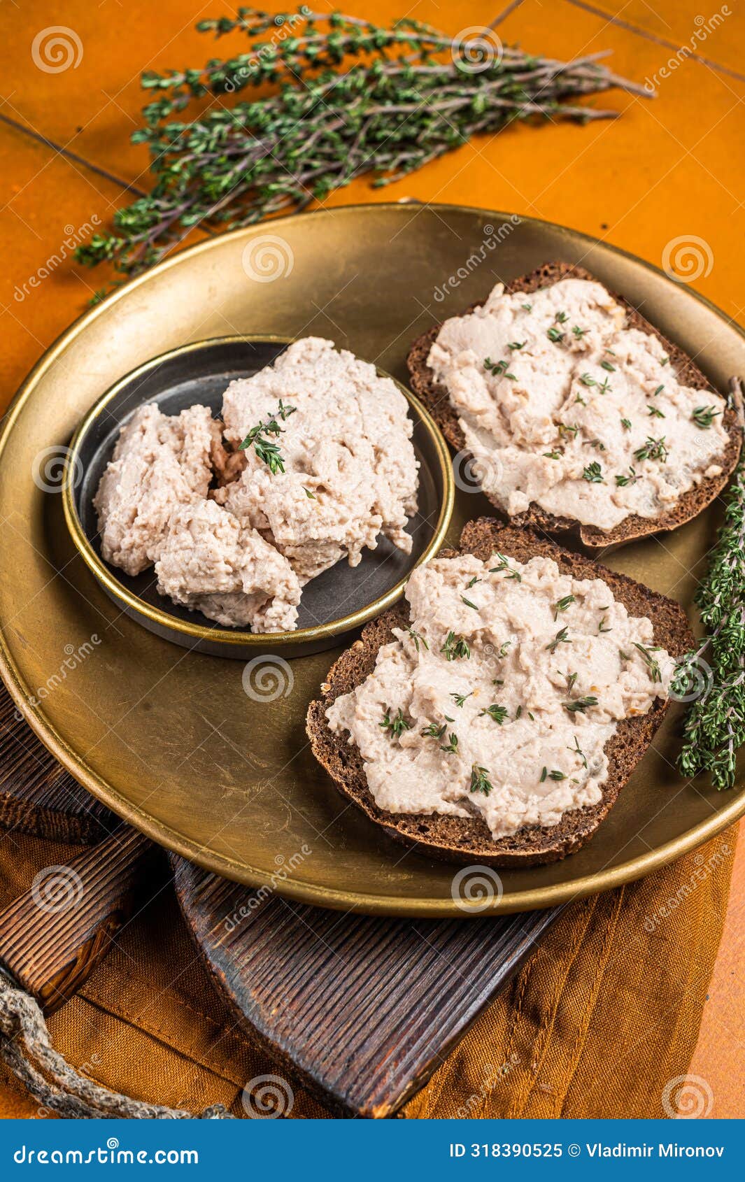 Toasts with Cod Liver Spread Pate on a Plate. Orange Background Stock ...