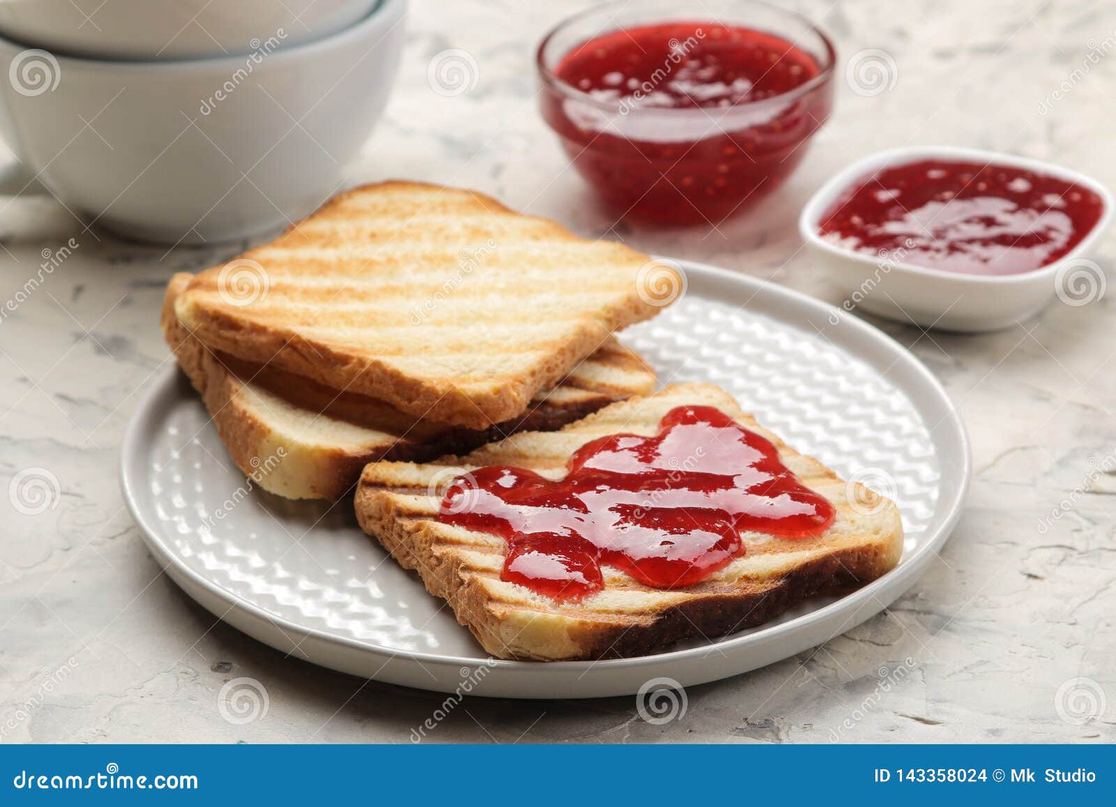 Toasts with Jam. Fried Crispy Toasts with Red Jam on a Light Concrete ...