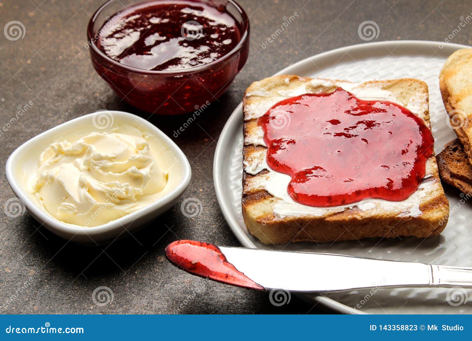 Toasts with Jam. Fried Crispy Toast with Red Jam on a Dark Background ...