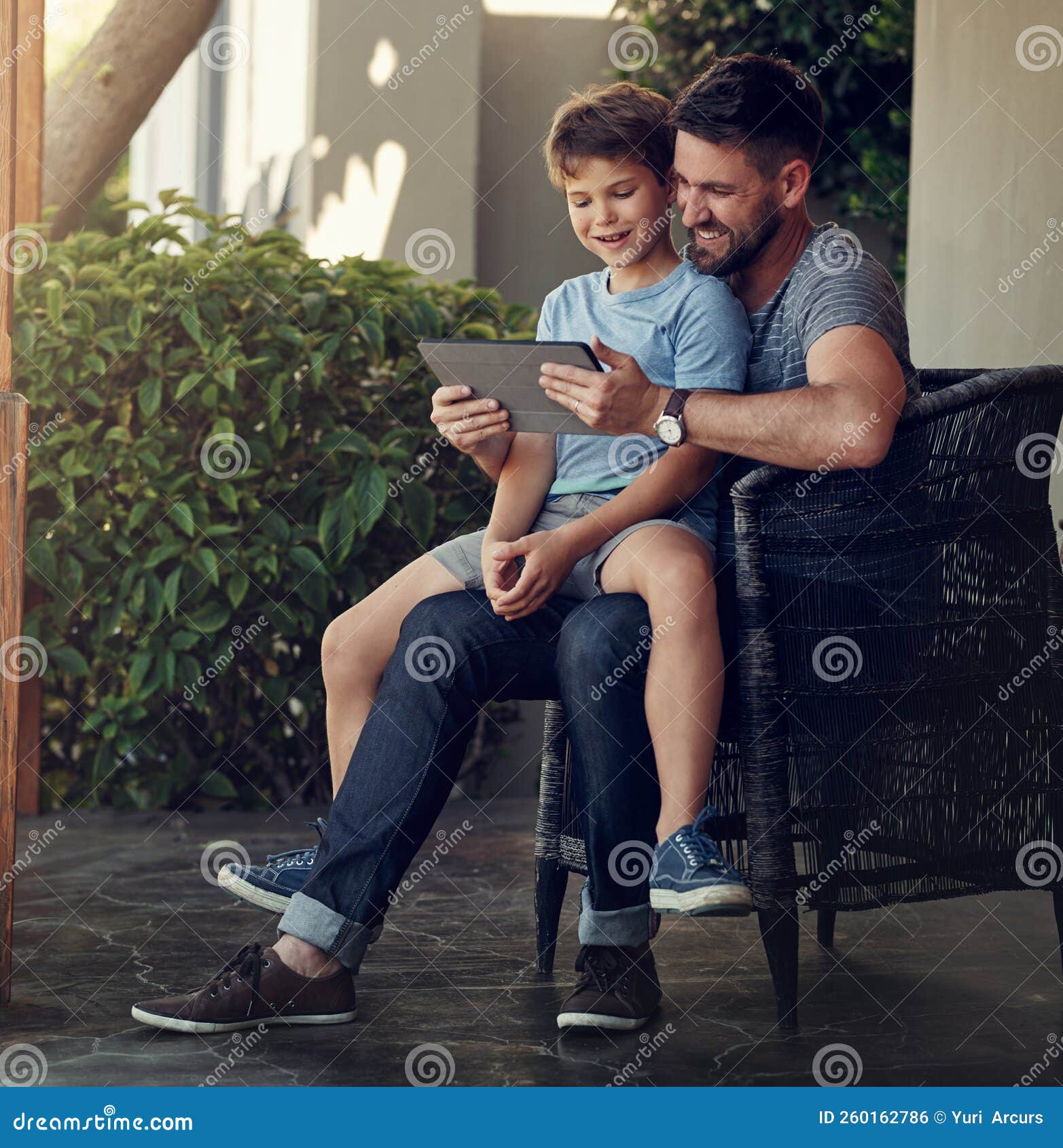 Today Im Going To Teach You about Technology. a Father and Son Using a ...