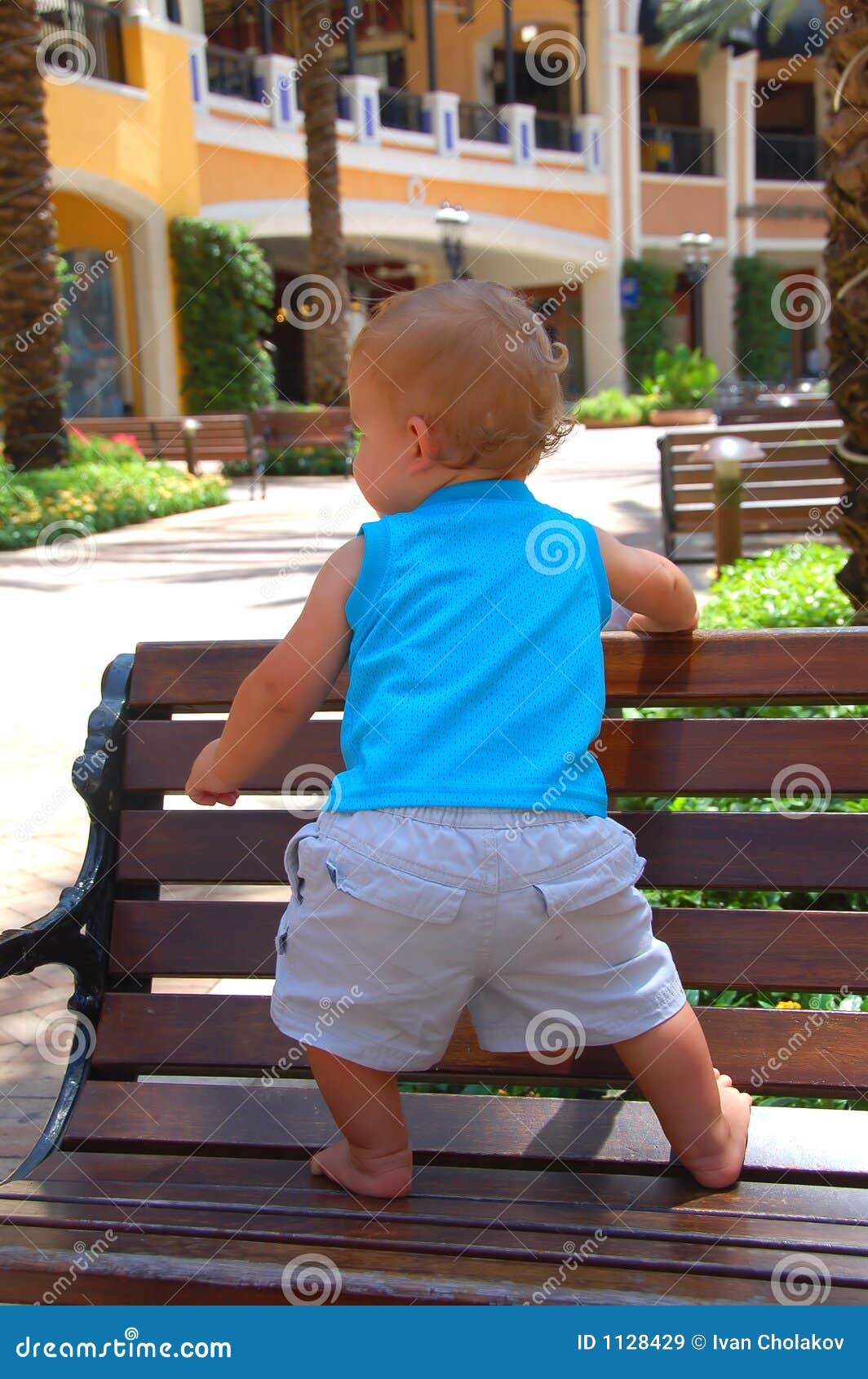 Toddler on bench stock image. Image of outside, child - 1128429