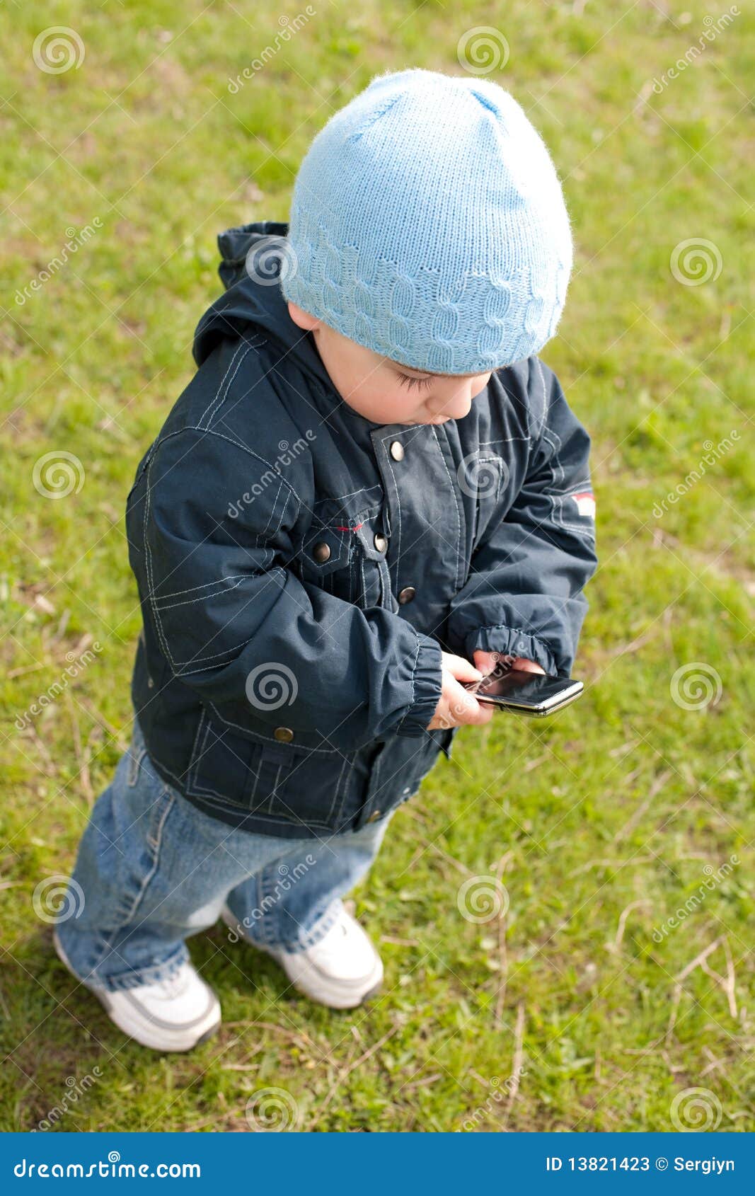 Toddler in Blue Sending SMS Over the Mobile Stock Image - Image of ... Toddler in Blue Sending SMS Over the Mobile Stock Image - Image of ...