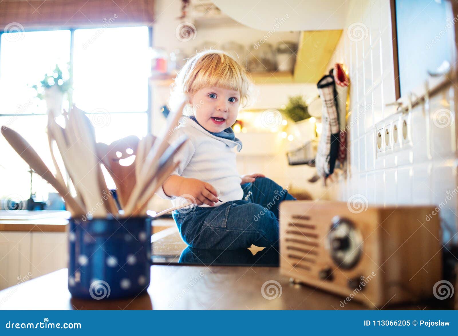 Toddler Boy in Dangerous Situation at Home. Child Safety Concept. Stock ... Toddler Boy in Dangerous Situation at Home. Child Safety Concept. Stock ...