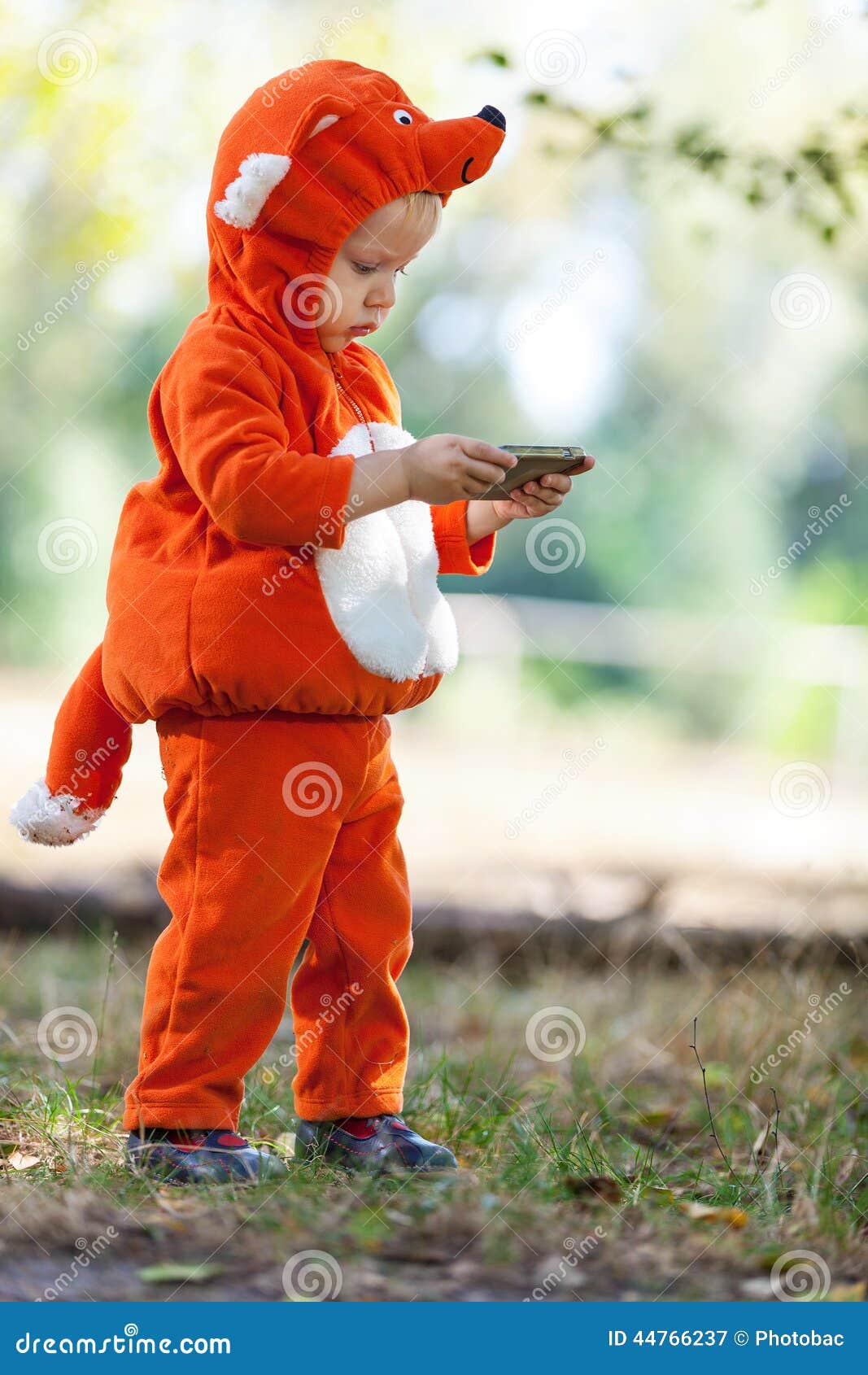 Toddler Boy in Fox Costume Holding Smartphone Stock Image - Image of ...