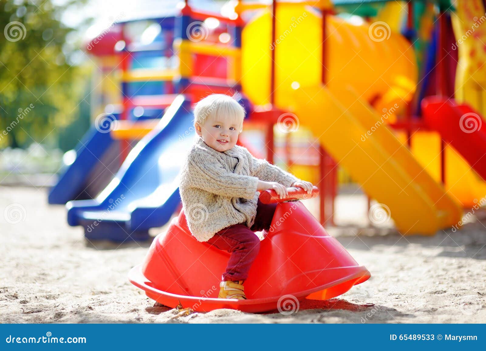 Toddler boy on playground stock image. Image of lifestyle - 65489533