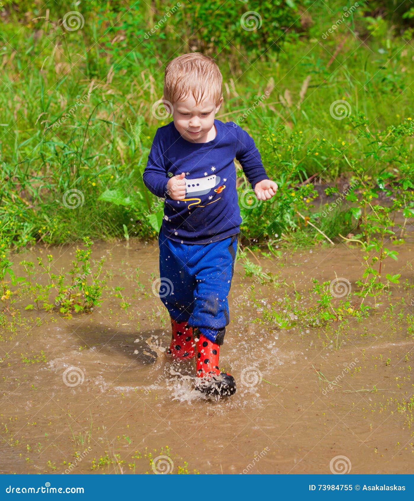 Toddler Boy Playing in Water Puddles Stock Image - Image of water, play ...