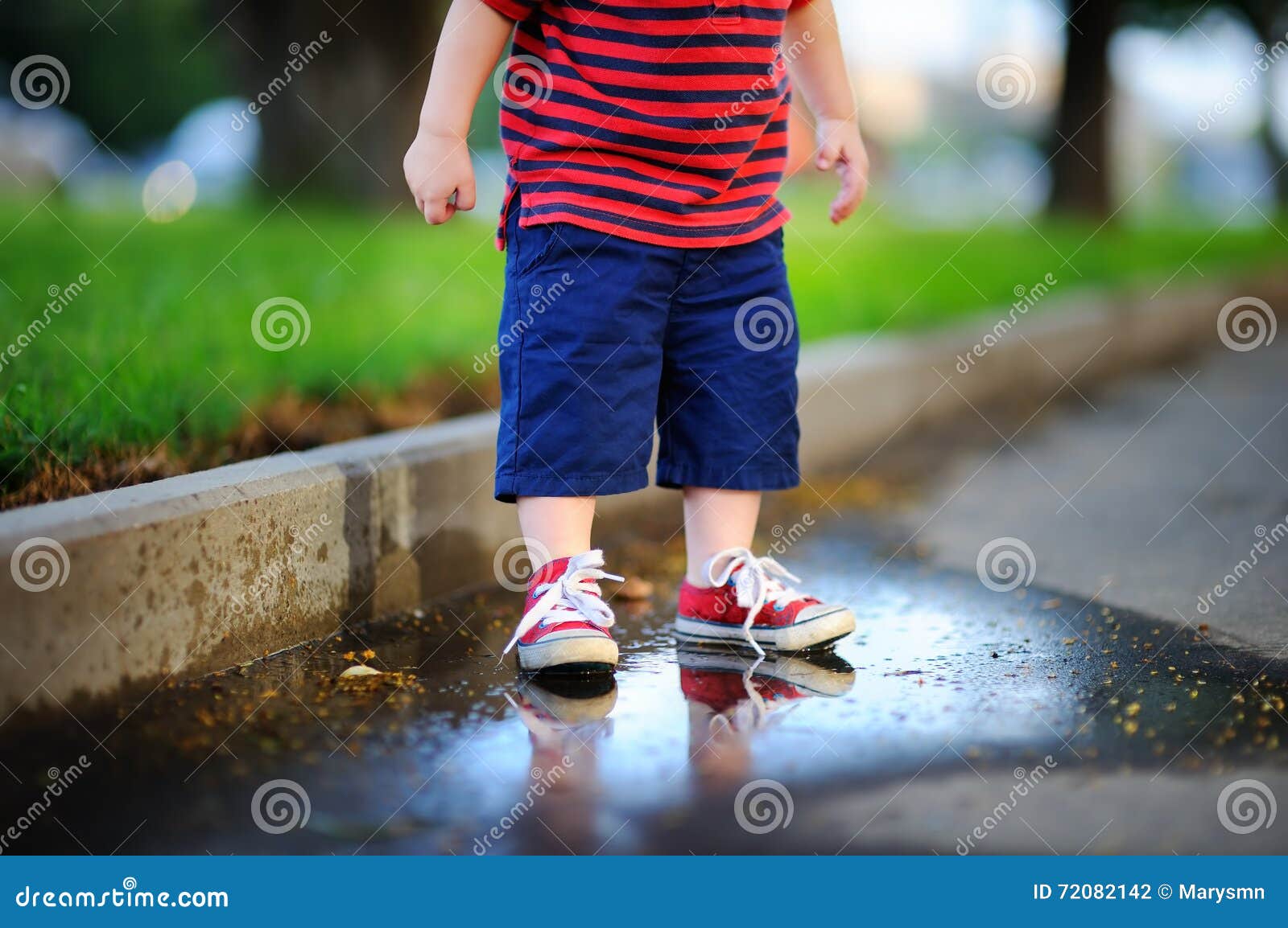Toddler Boy Standing in a Puddle Stock Photo - Image of lifestyle ...