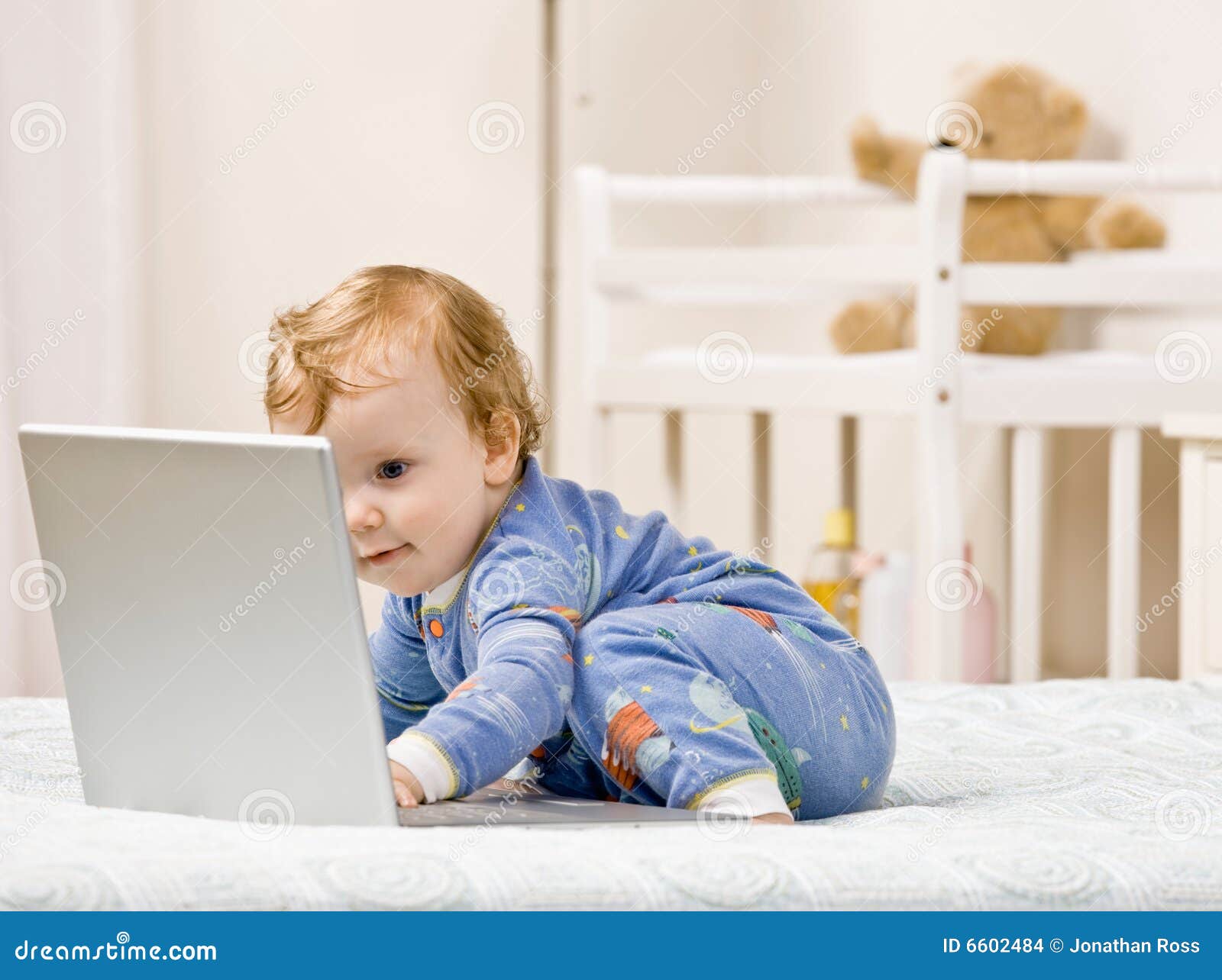 Toddler Boy Typing On Laptop In Bedroom Stock Photo - Image of typist ...