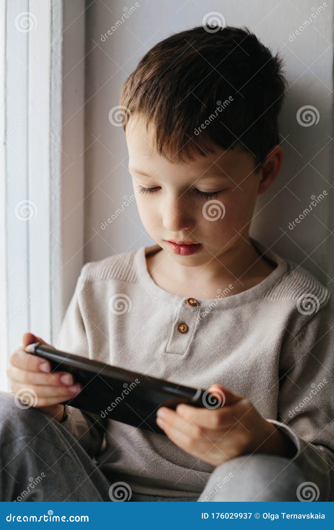 Toddler Boy Using Tablet or Smartphone. Cute Five Years Old Boy Sitting ...