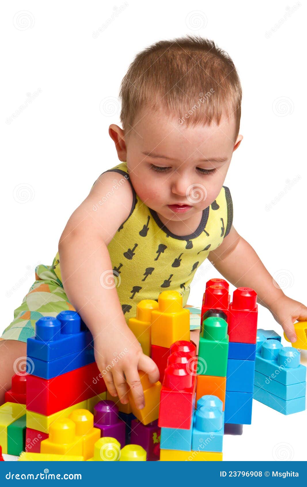 Toddler building a castle stock photo. Image of build - 23796908