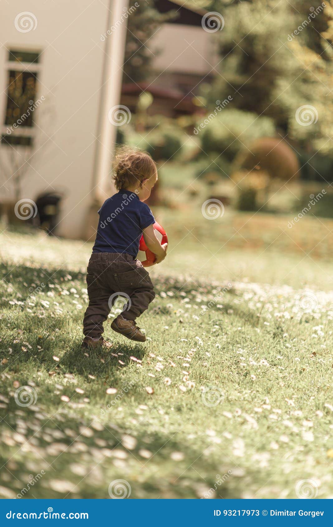 Toddler carrying a ball stock image. Image of small, outdoor - 93217973