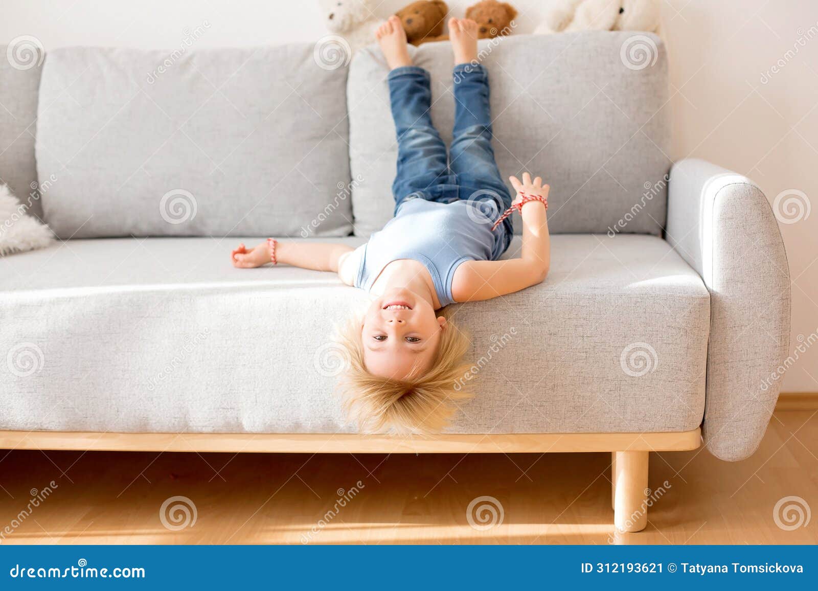 Toddler Child, Hanging Upside Down from a Couch at Home, Smiling Stock ... Toddler Child, Hanging Upside Down from a Couch at Home, Smiling Stock ...