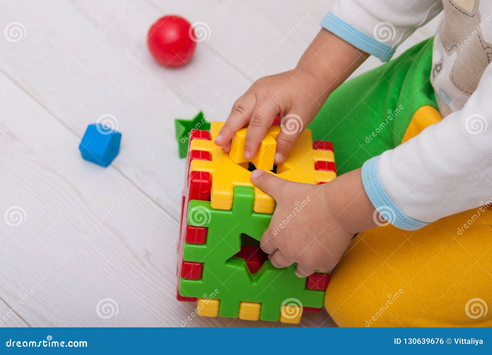 Toddler or Child is Playing with Plastic Shape Sorter. Stock Photo ...